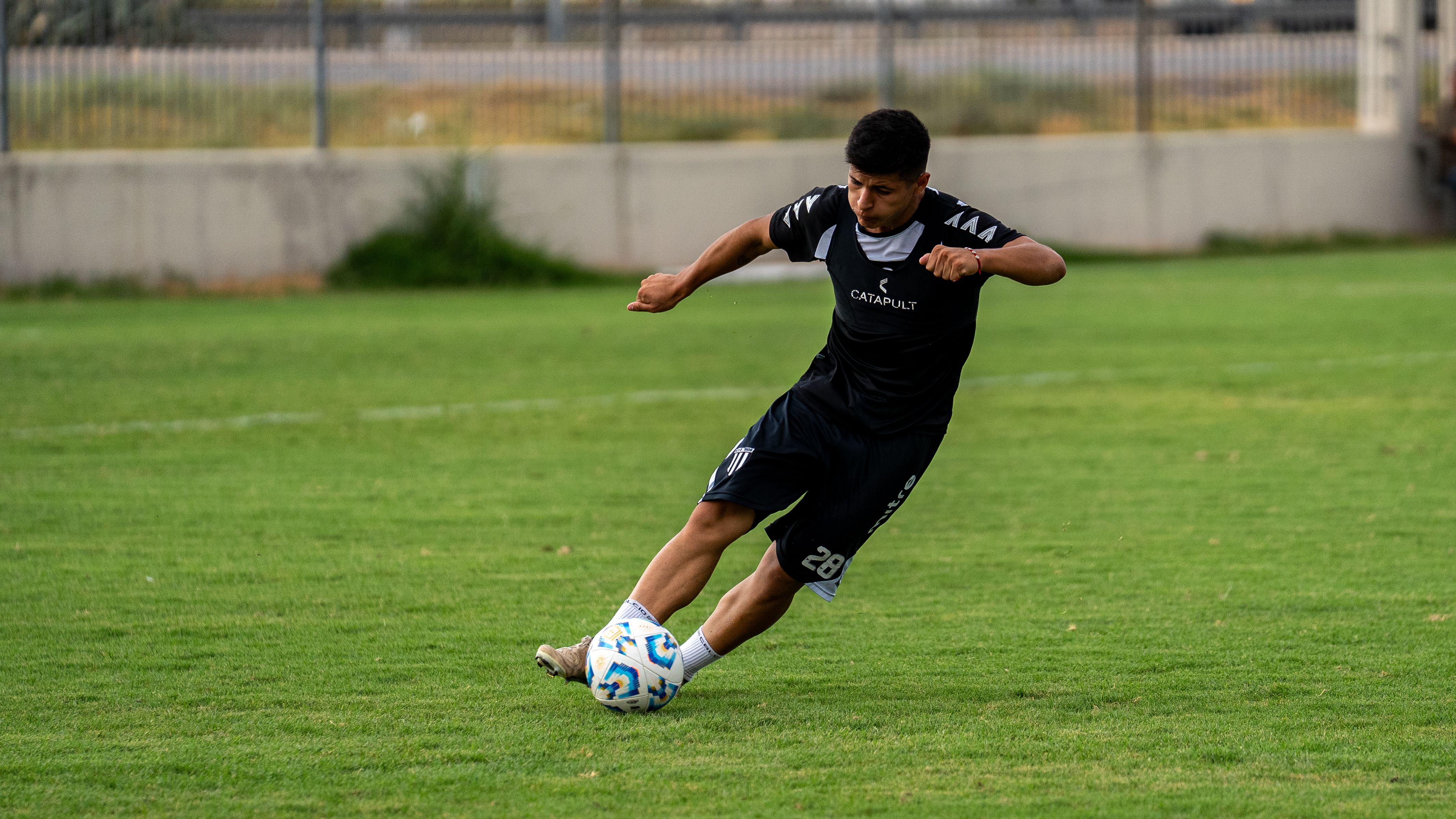 Soccer Player Kicking Ball in Action · Free Stock Photo