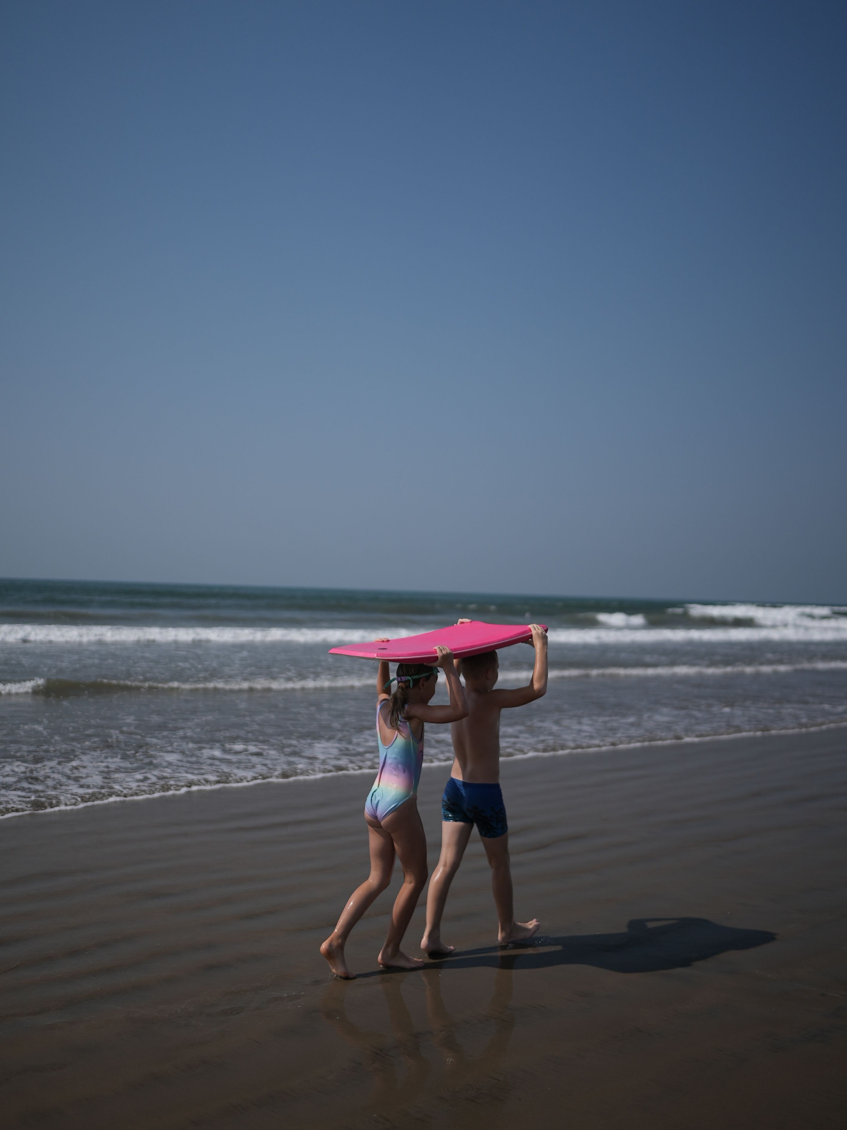 Children Enjoying Beach Day with Surfboard in Goa · Free Stock Photo