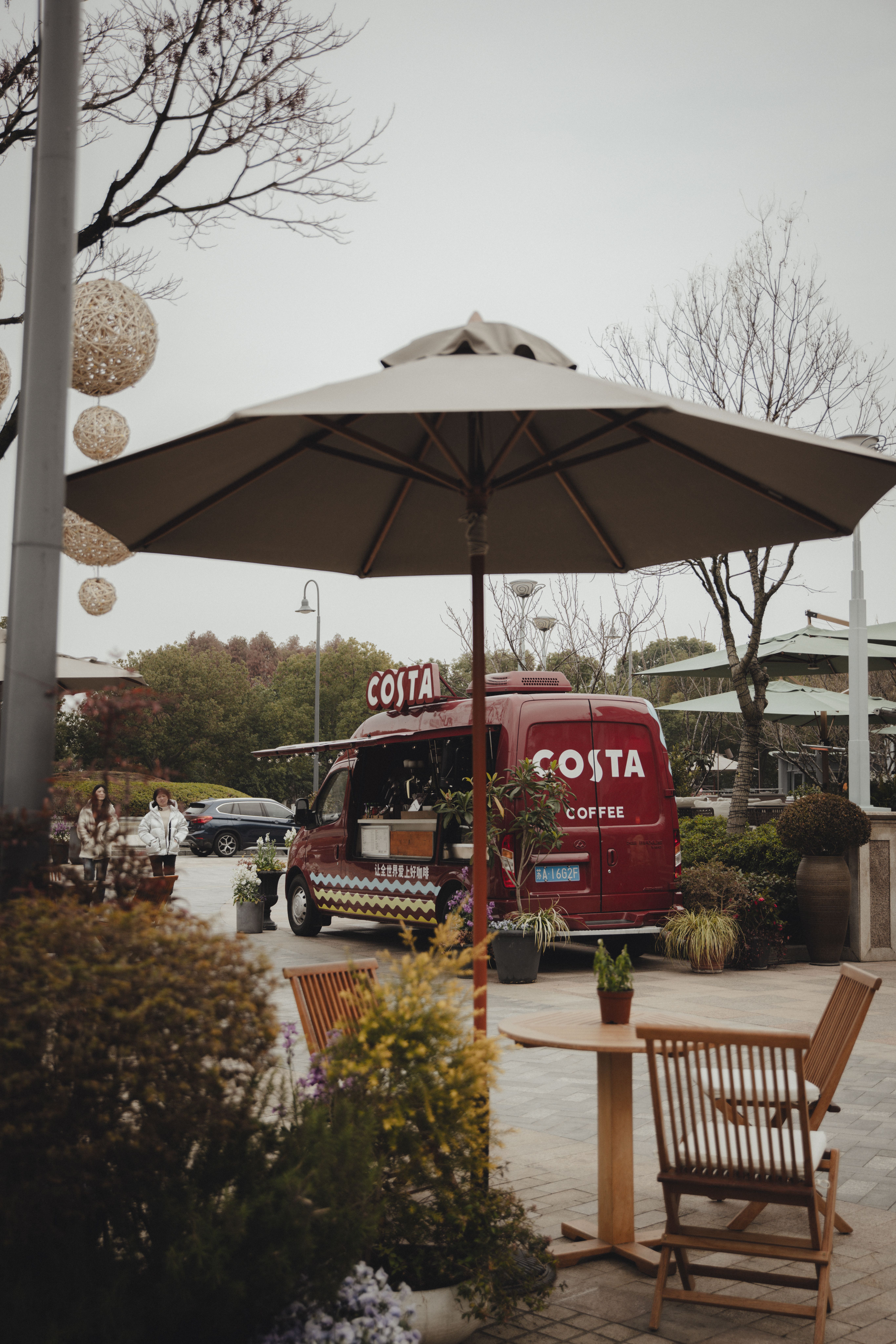 Cozy Outdoor Coffee Van in Modern Urban Setting · Free Stock Photo