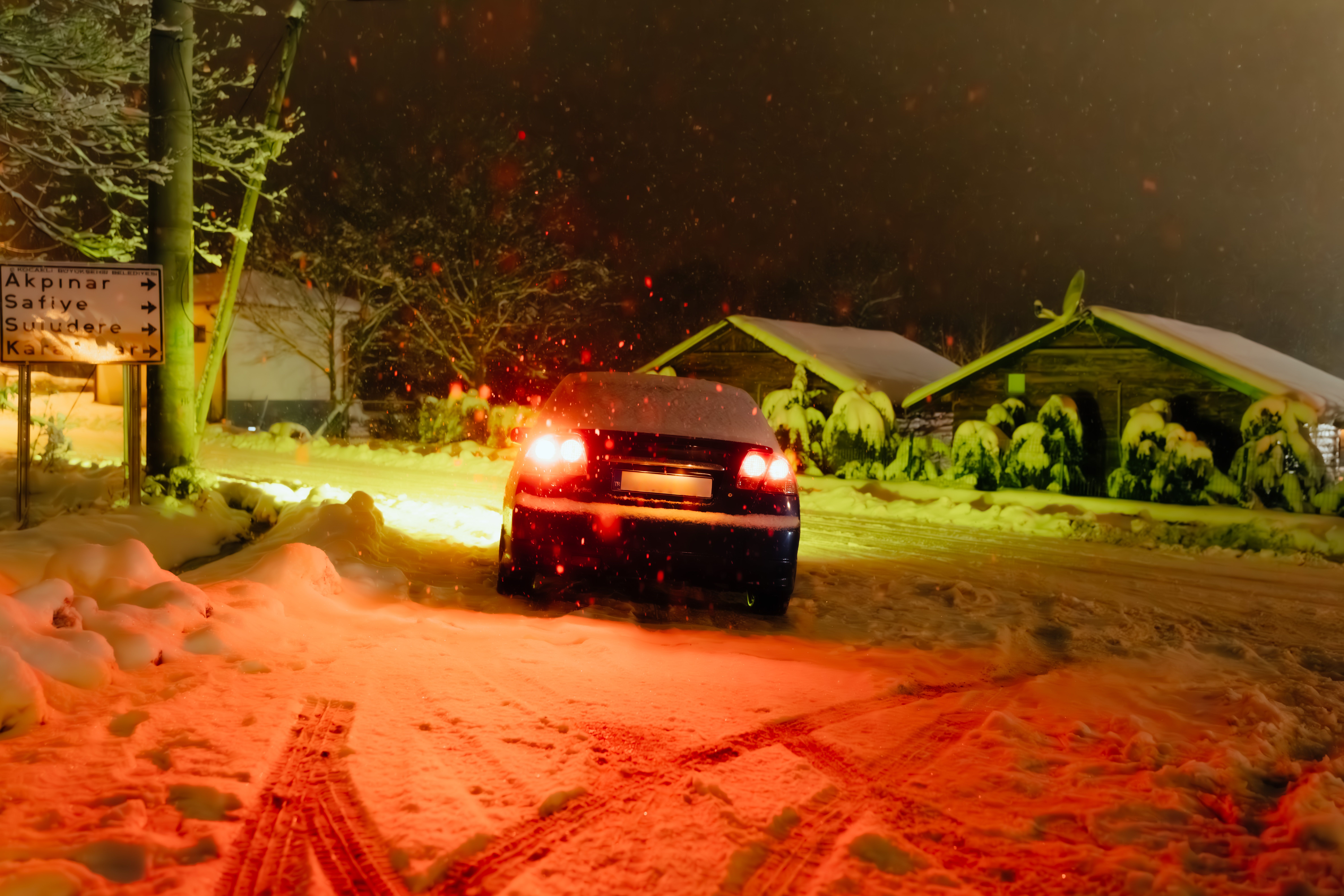 Black Car on Roadway While Raining during Nighttime · Free Stock Photo