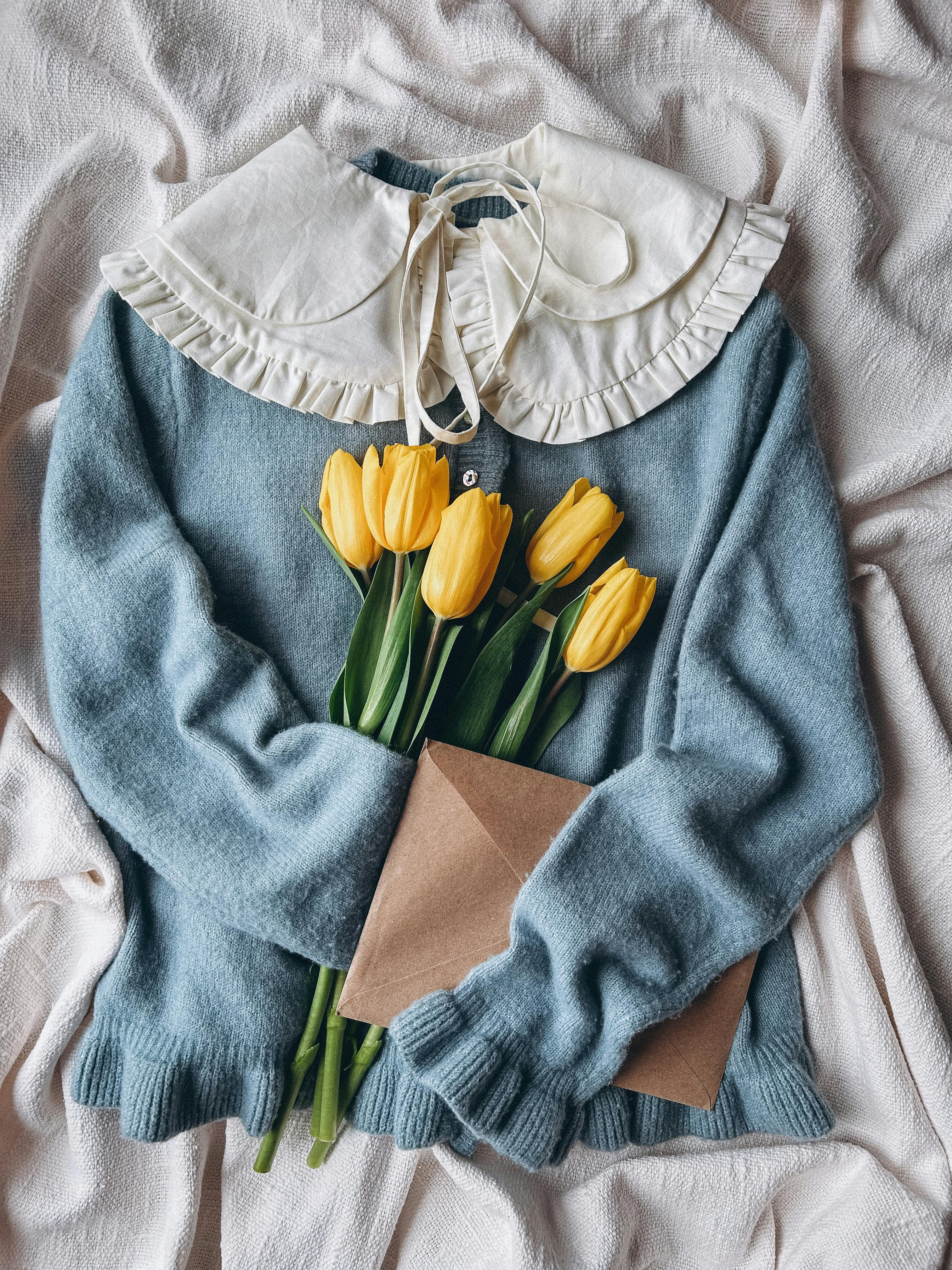Cozy Blue Sweater with Yellow Tulips Bouquet · Free Stock Photo