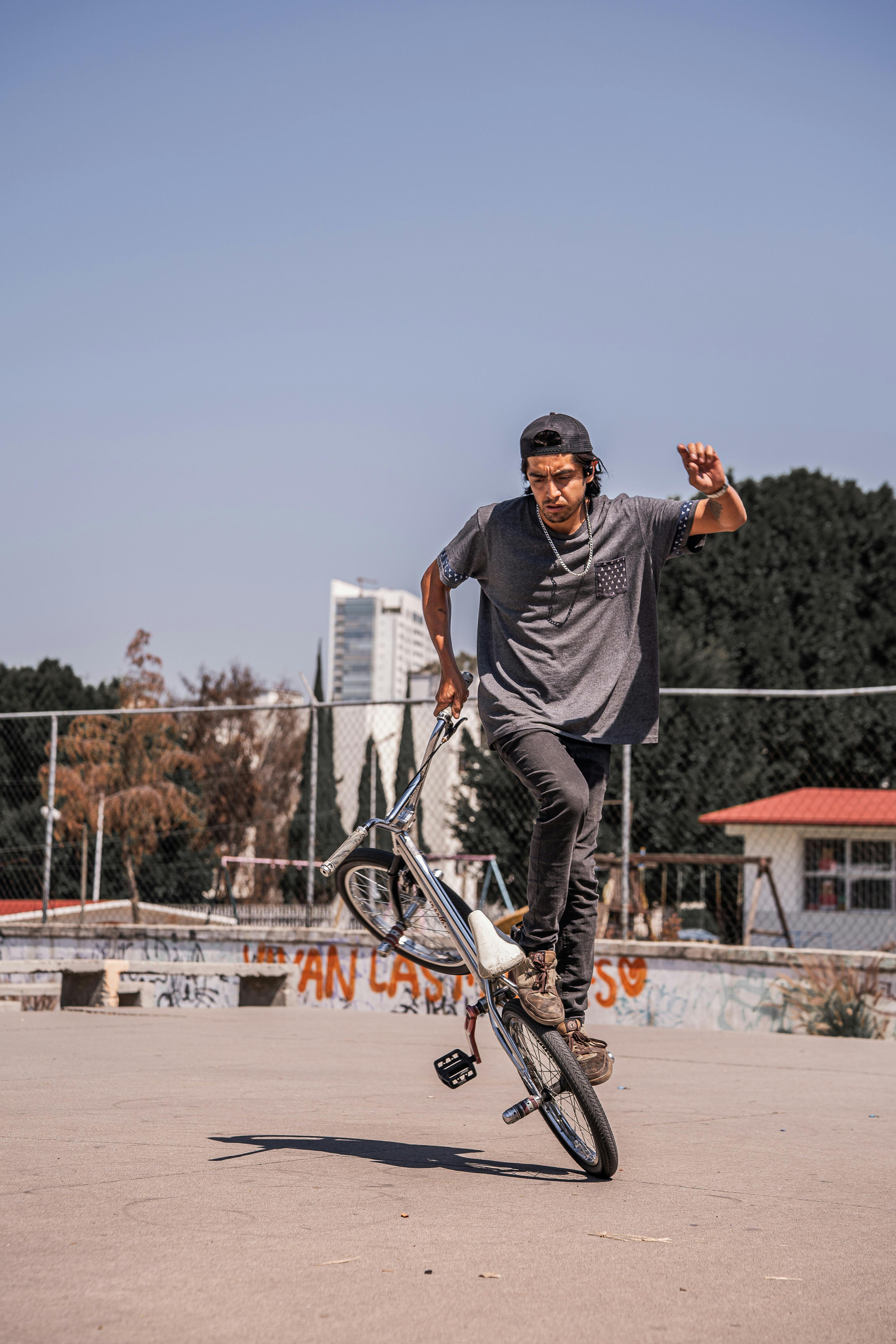 BMX Stunt Rider Performing in Urban Park · Free Stock Photo
