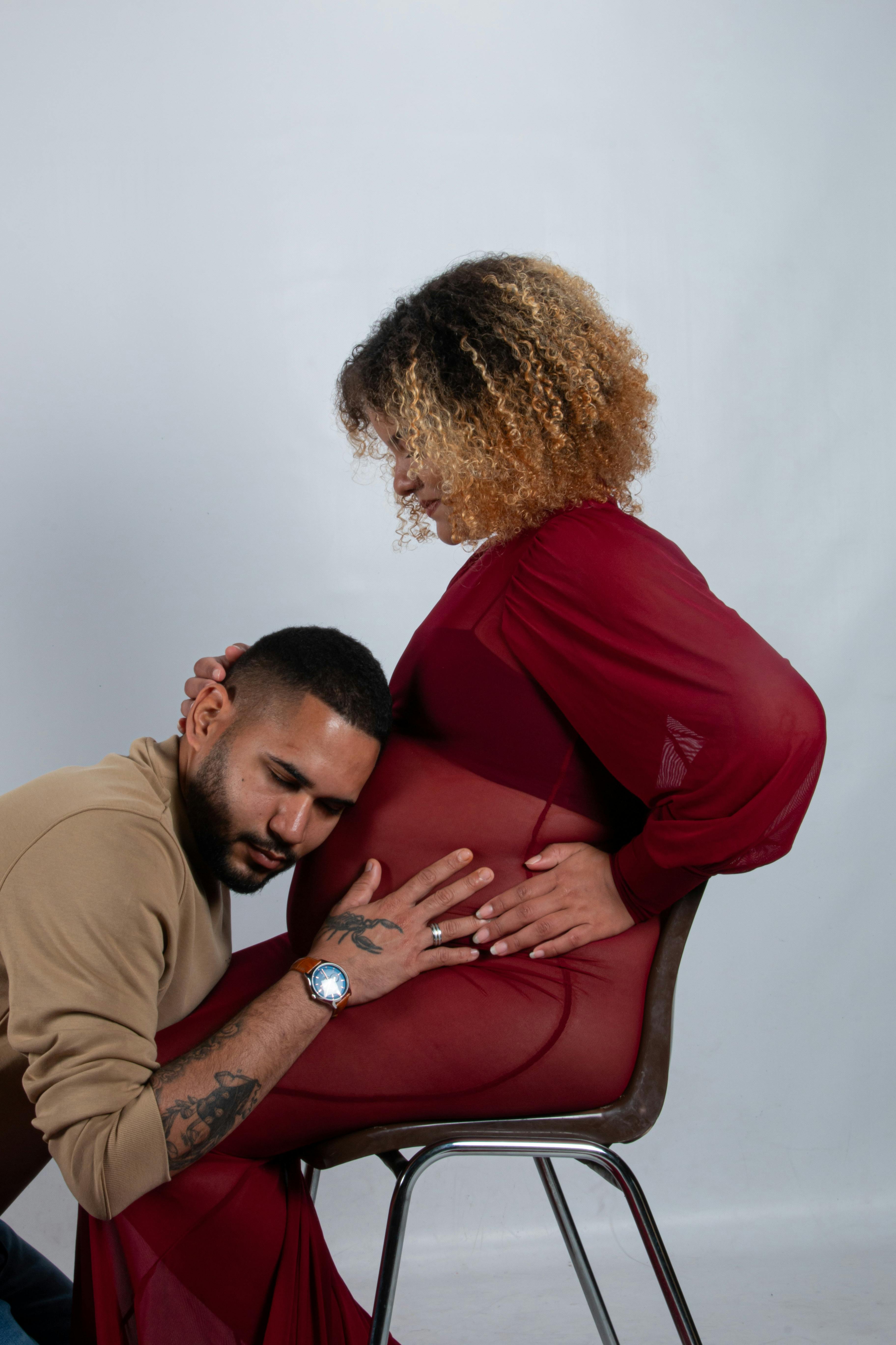 Expecting couple in intimate maternity moment · Free Stock Photo