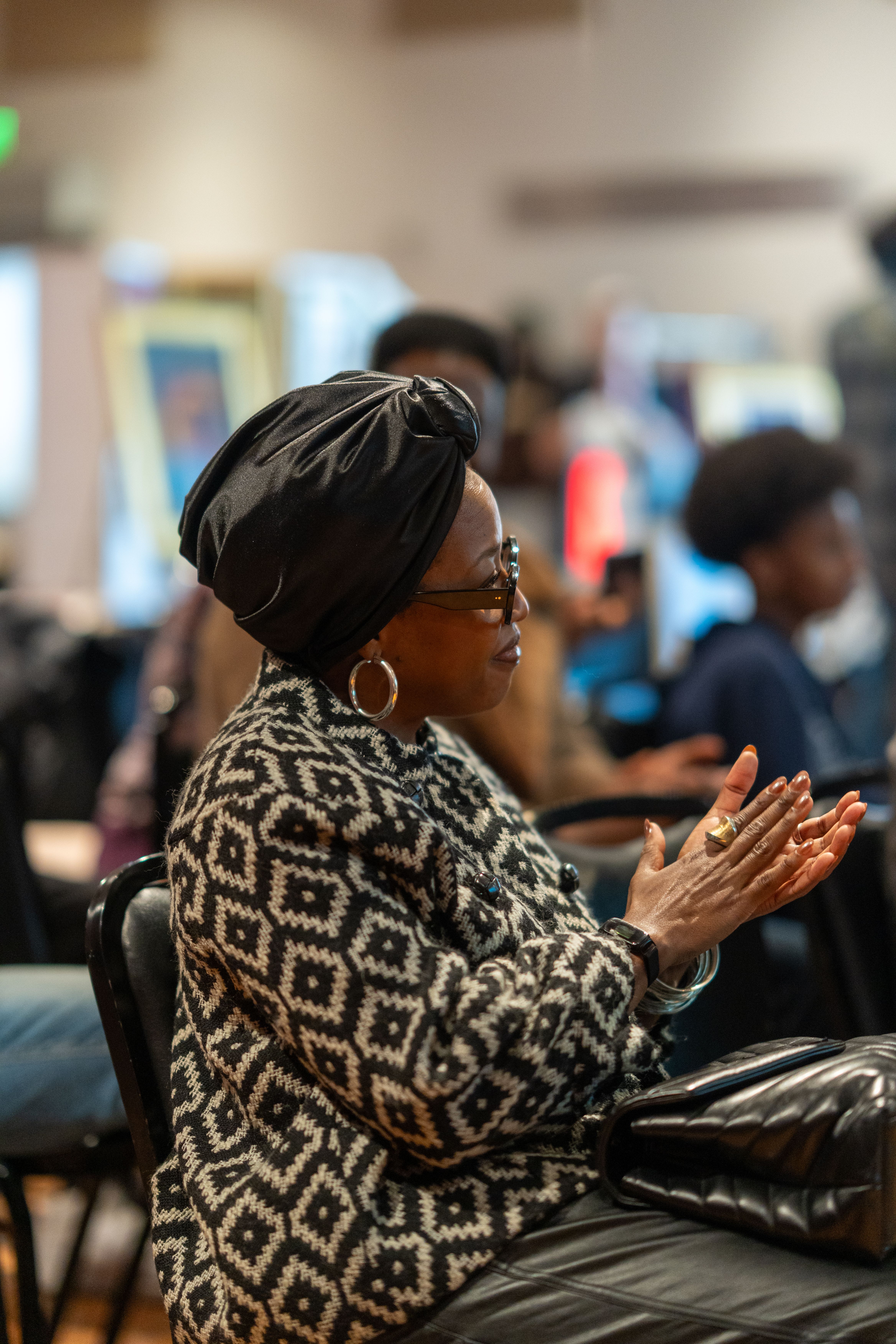Engaged Audience Member Clapping at Event · Free Stock Photo
