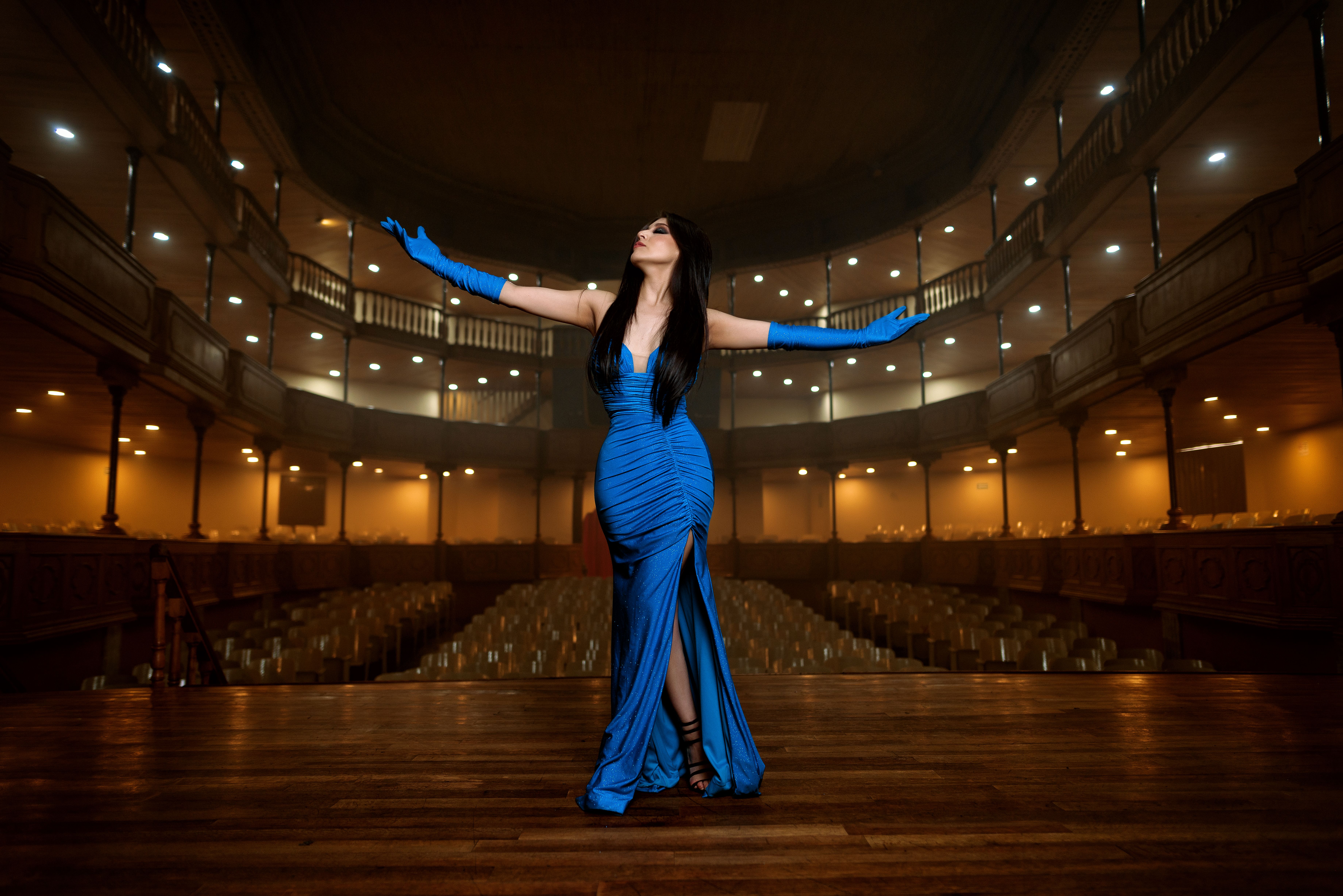 Elegant Woman in Blue Dress on Theater Stage · Free Stock Photo