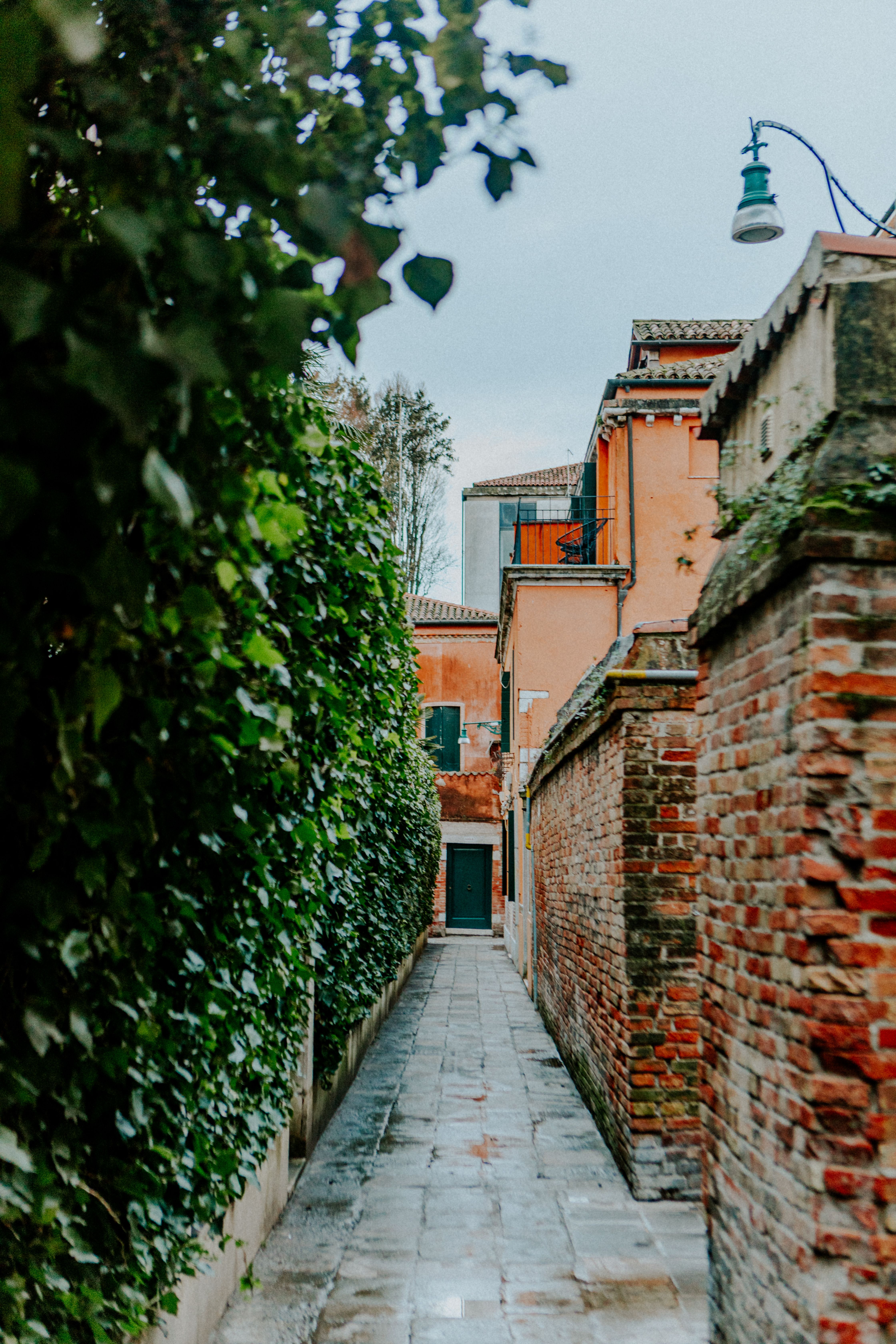 Charming European Alley with Brick Walls · Free Stock Photo