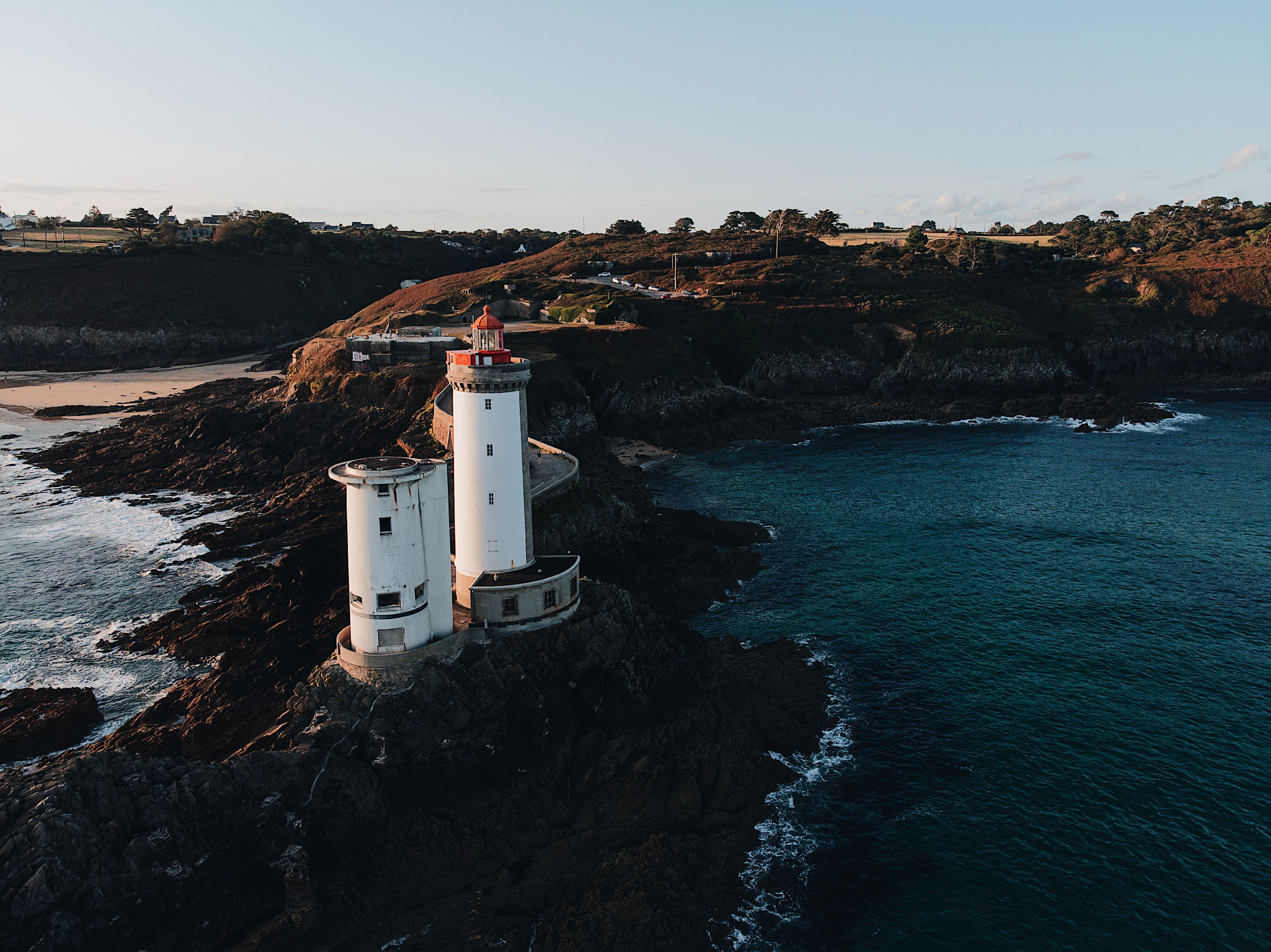 Photo of Lighthouse Near Coast · Free Stock Photo