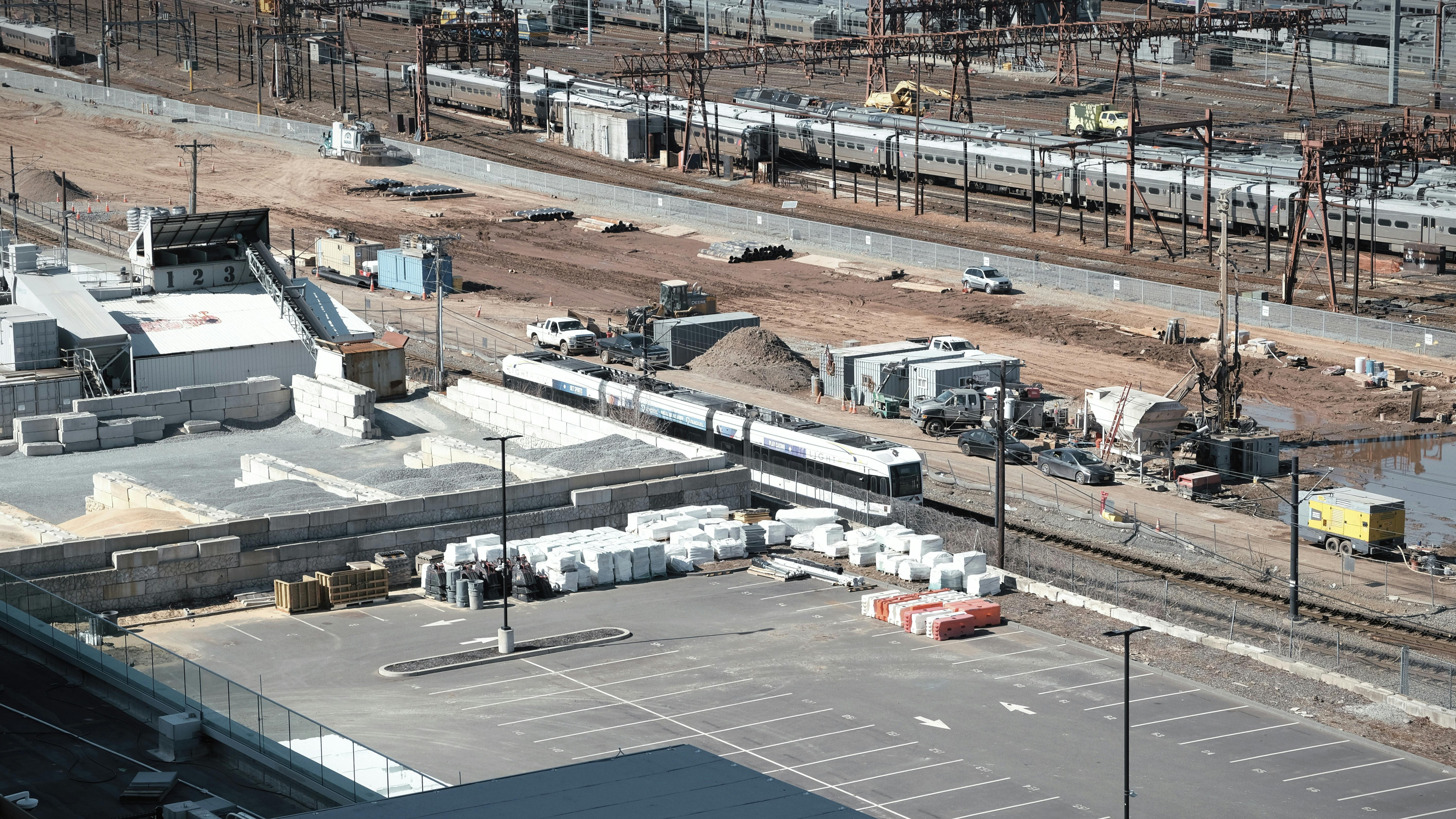 Industrial Train Yard with Construction Activity · Free Stock Photo