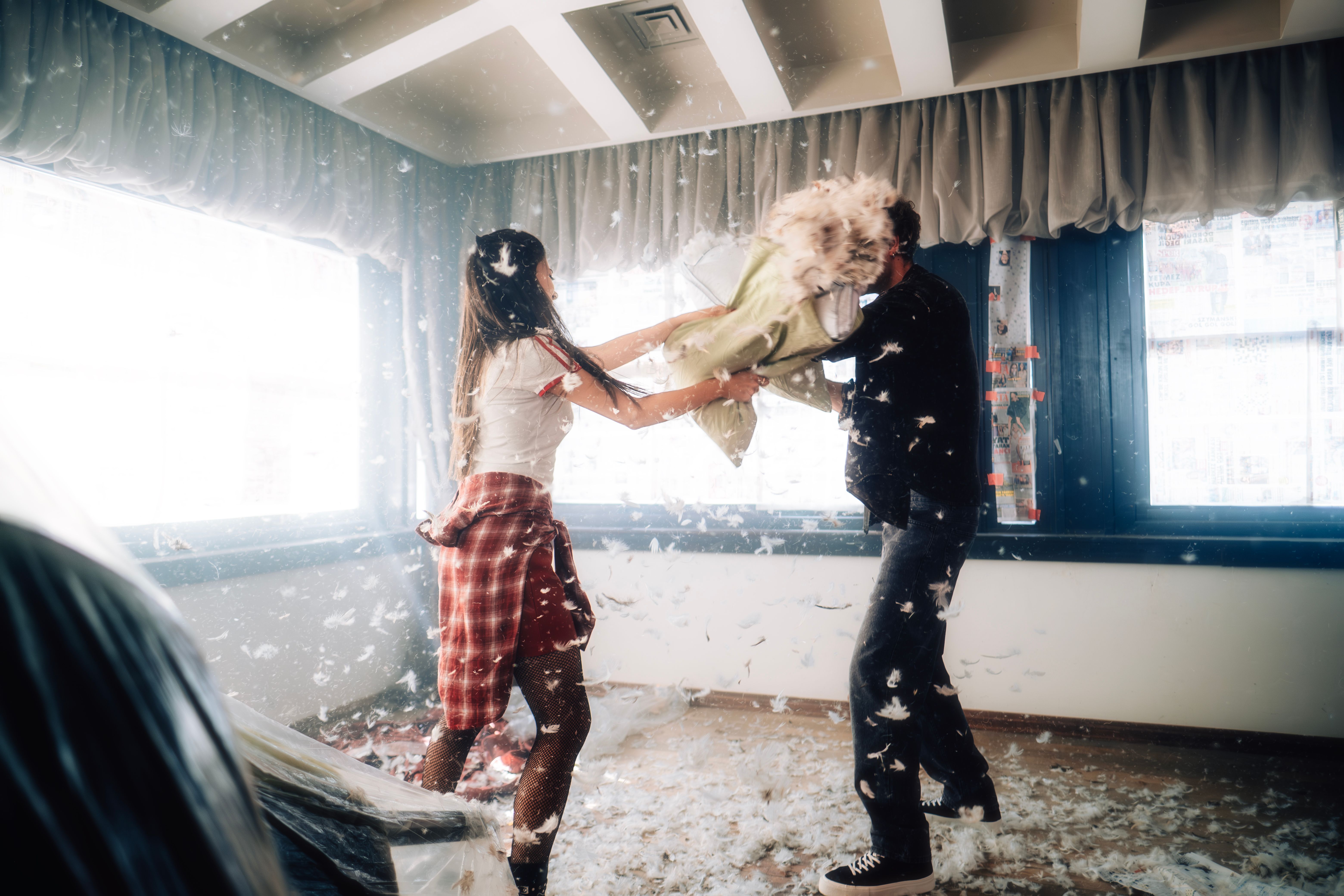 Energetic Indoor Pillow Fight Scene · Free Stock Photo