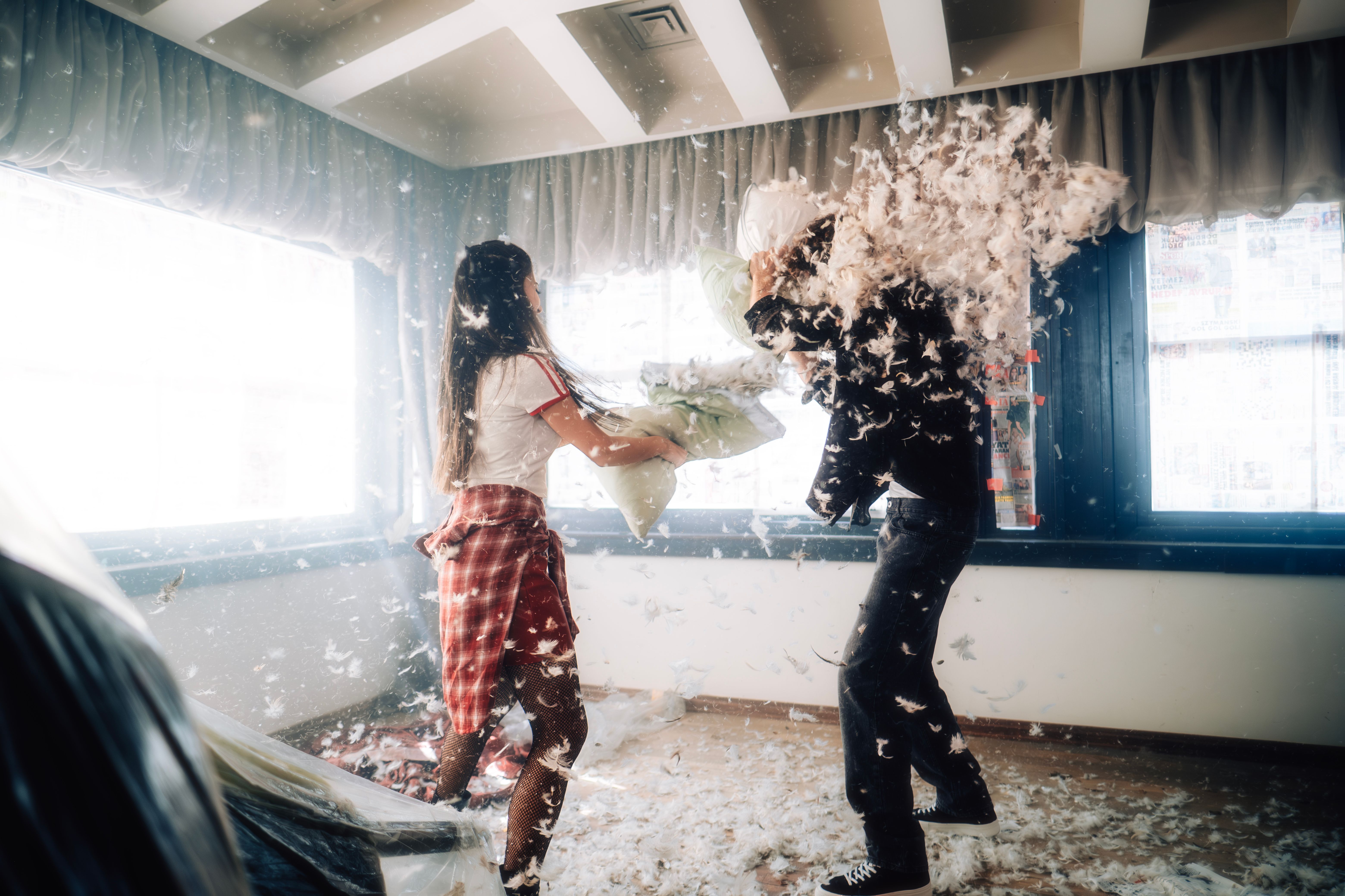 Energetic Indoor Pillow Fight Scene · Free Stock Photo