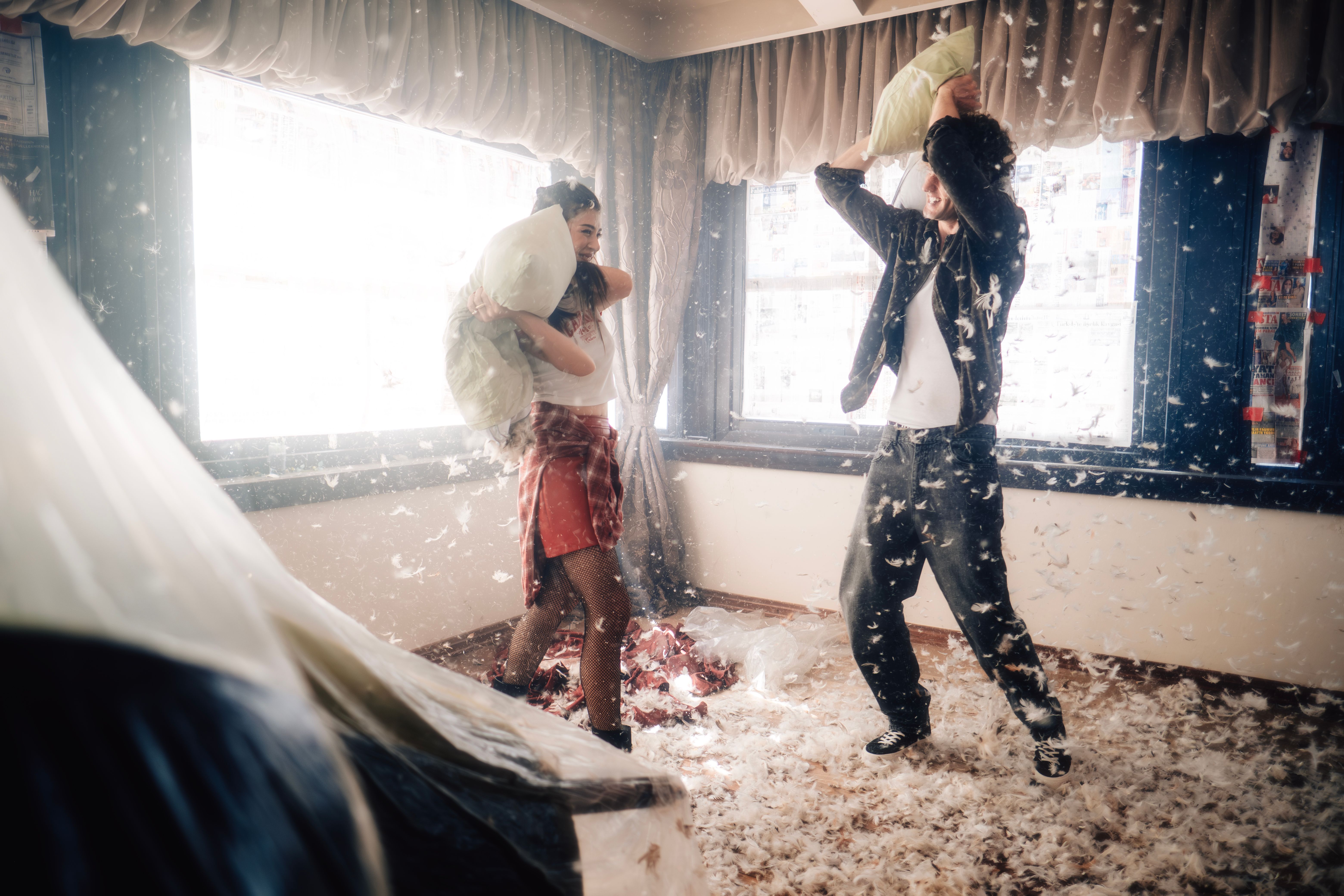 Energetic Indoor Pillow Fight Scene · Free Stock Photo