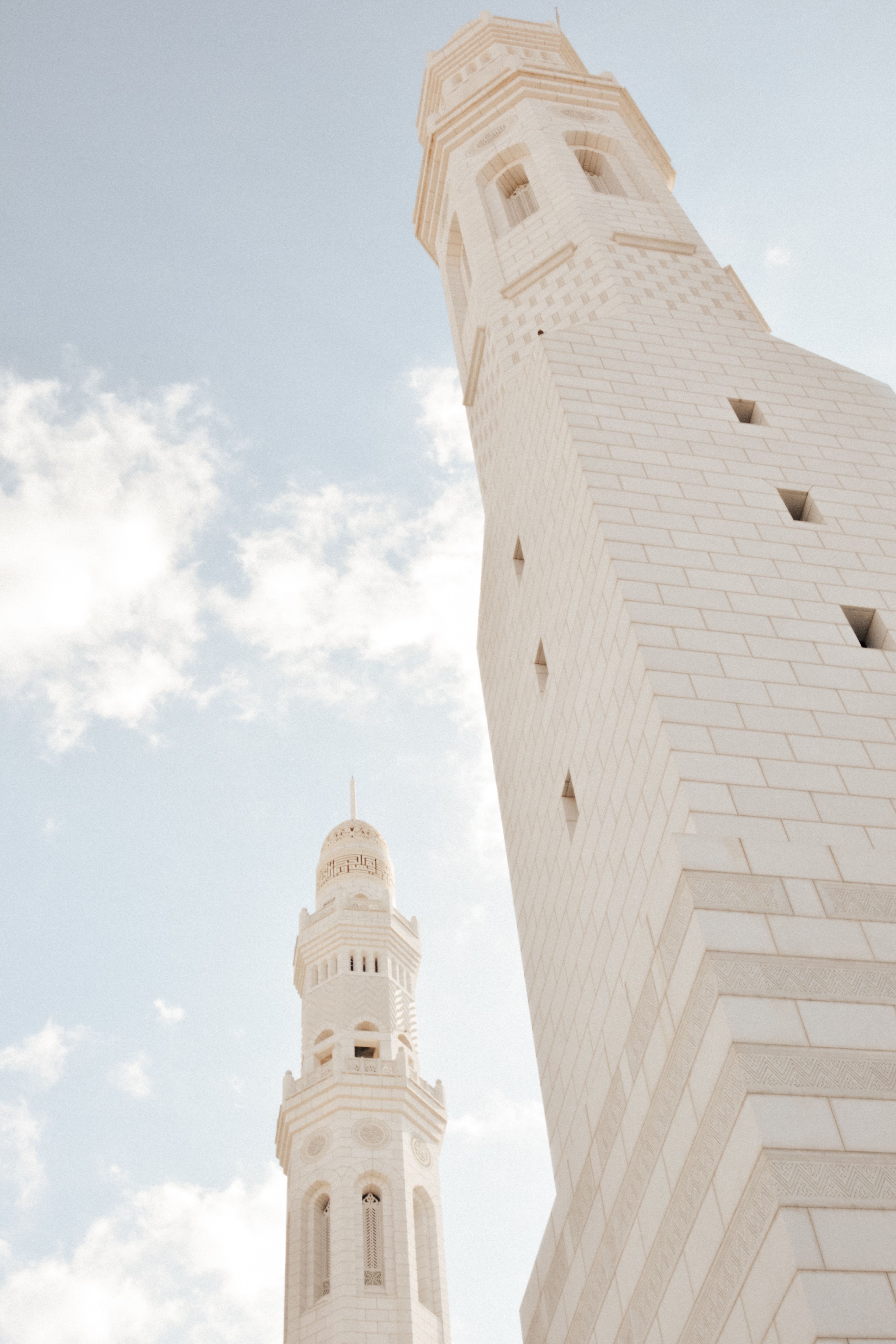 Elegant Minarets of Muscat Against Blue Sky · Free Stock Photo