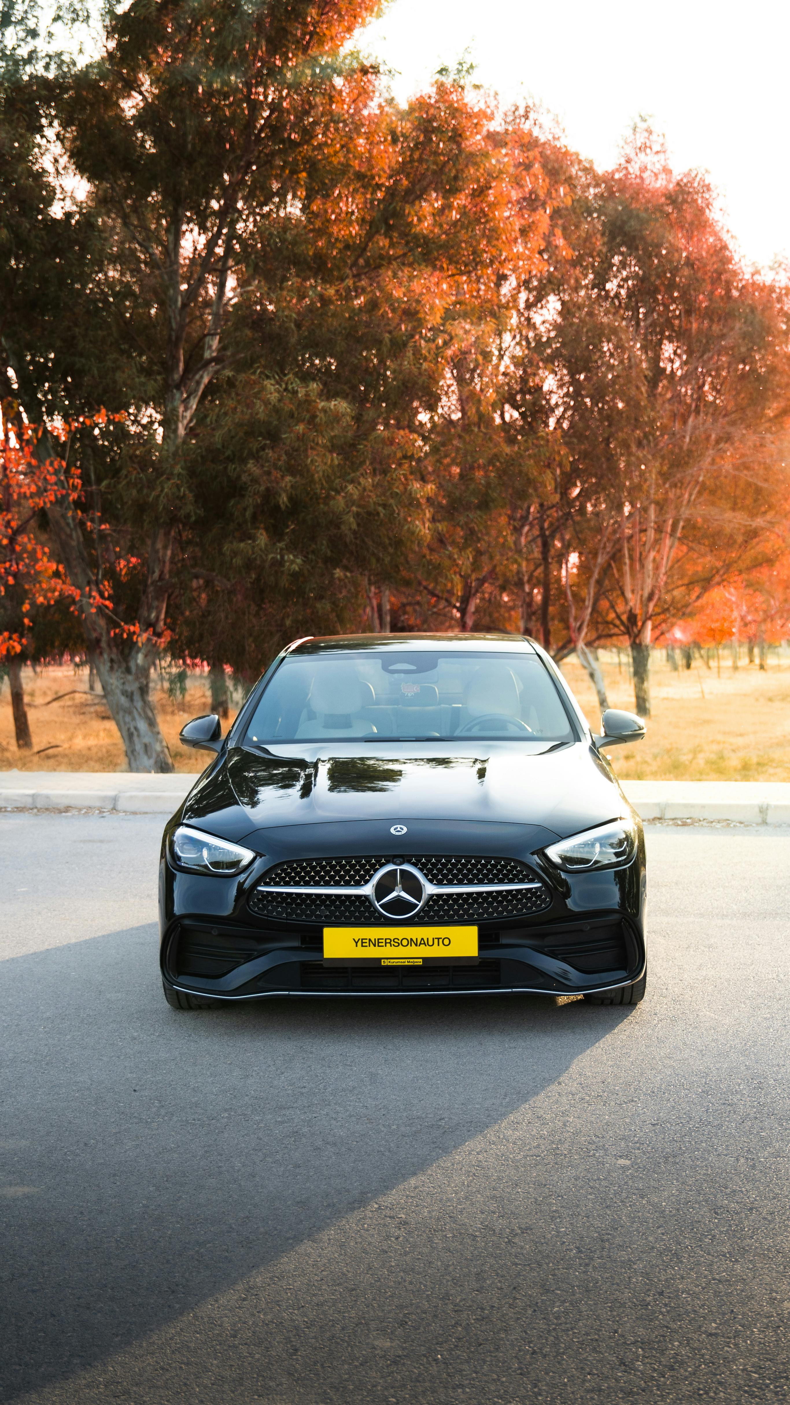 Elegant Black Car on Scenic Fall Road in İzmir · Free Stock Photo