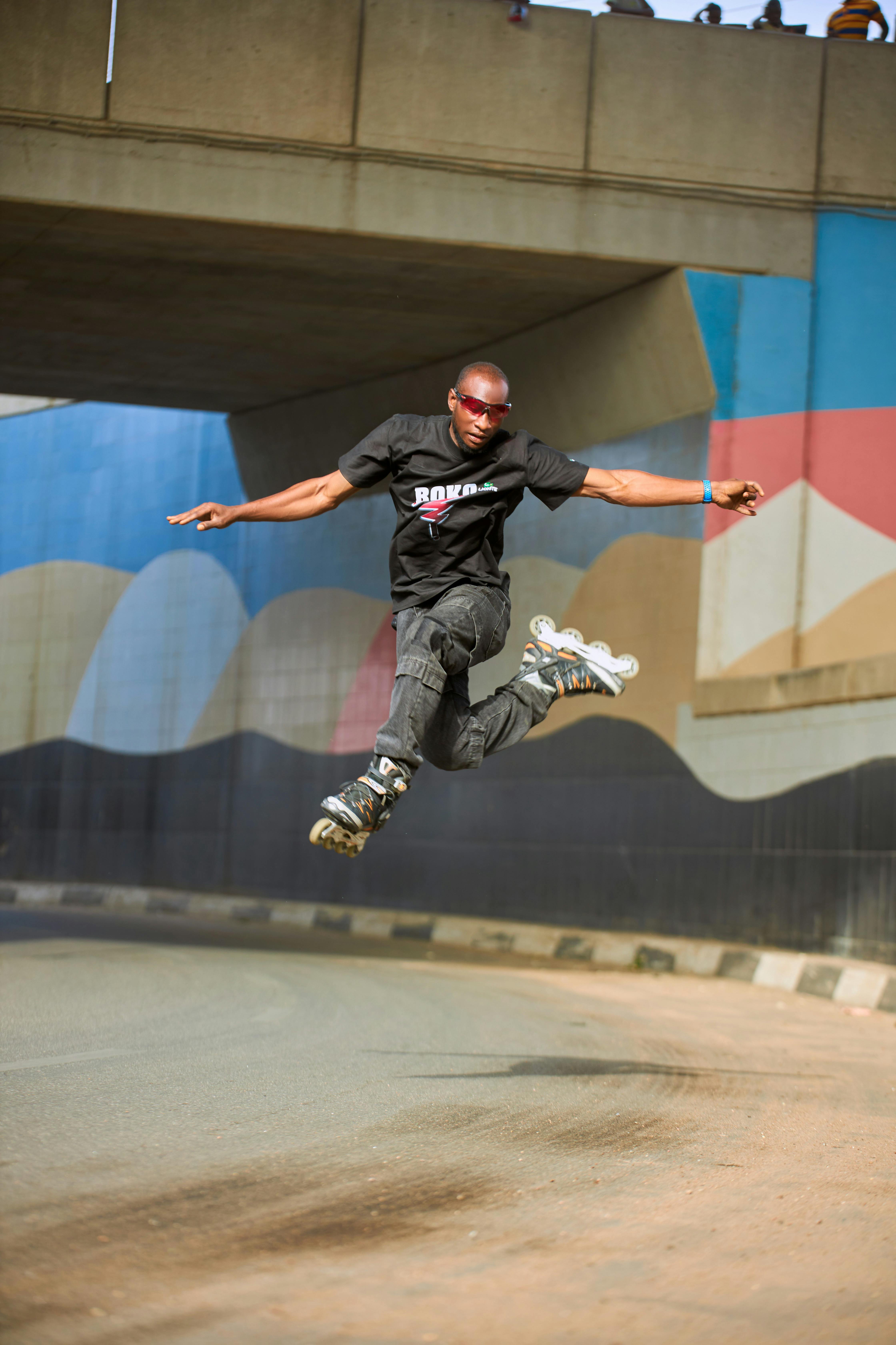 Dynamic Rollerblader Performing a High Jump Outdoors · Free Stock Photo