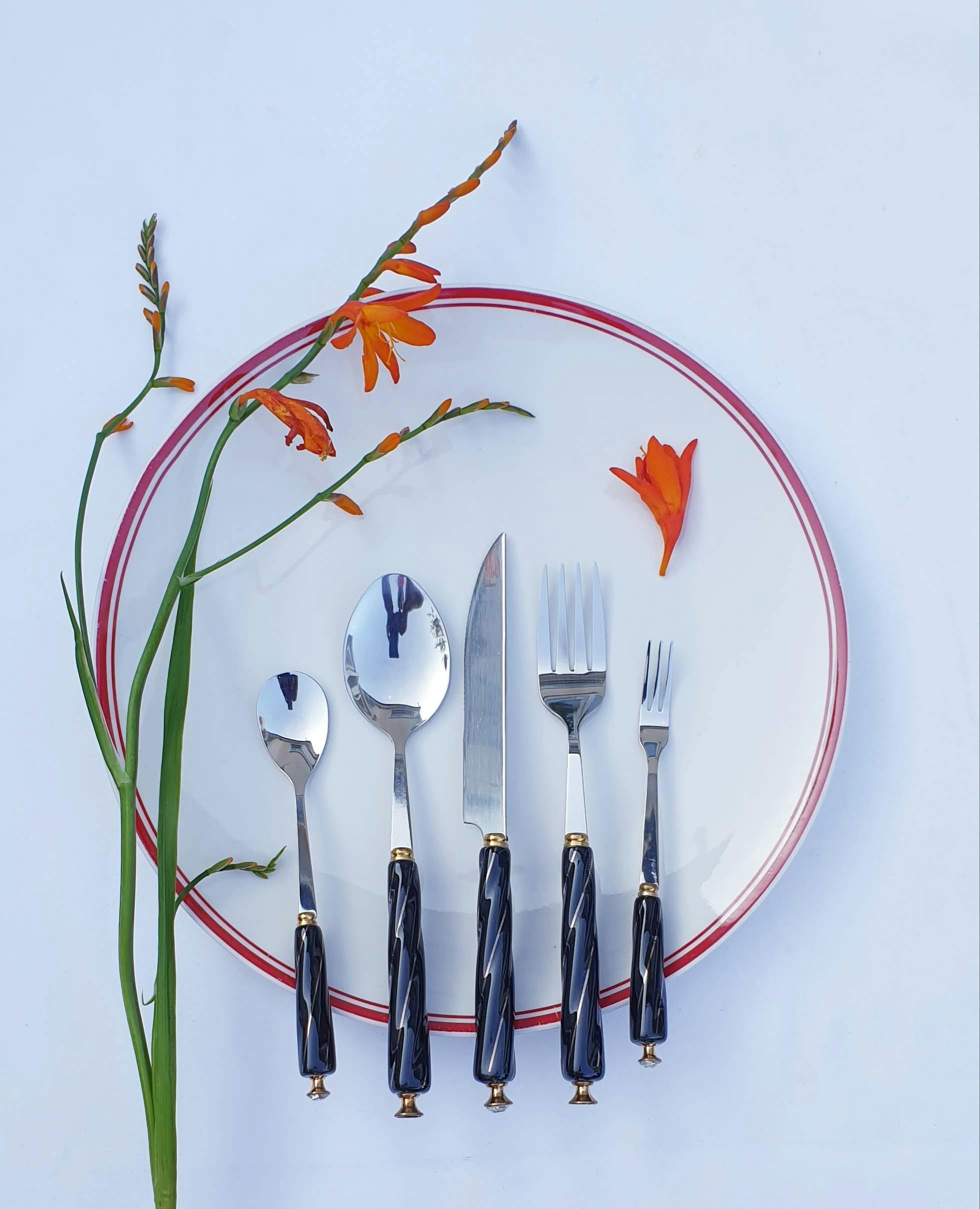 Elegant Cutlery Set with Floral Accent · Free Stock Photo