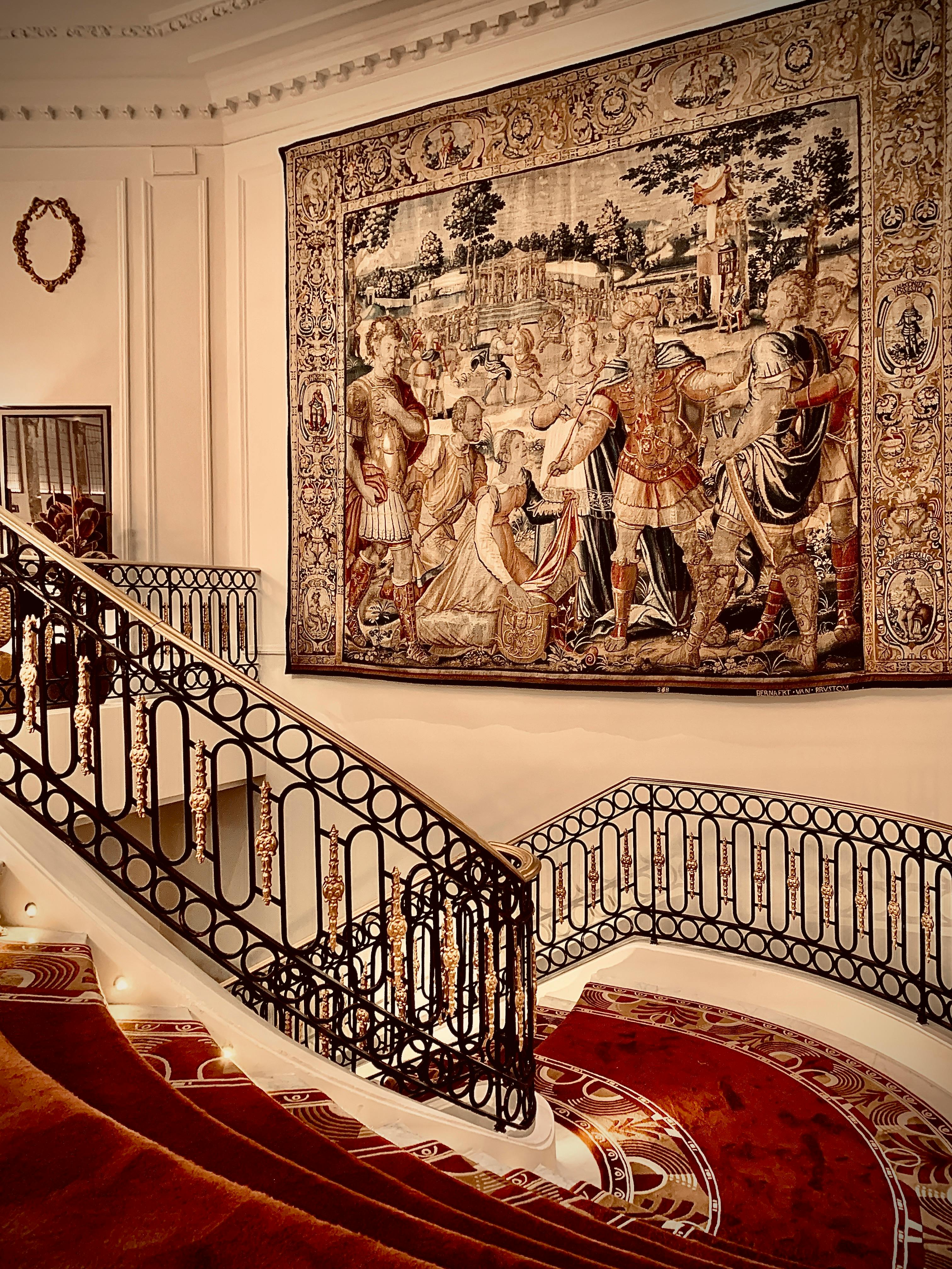 Elegant Interior Staircase with Majestic Tapestry · Free Stock Photo