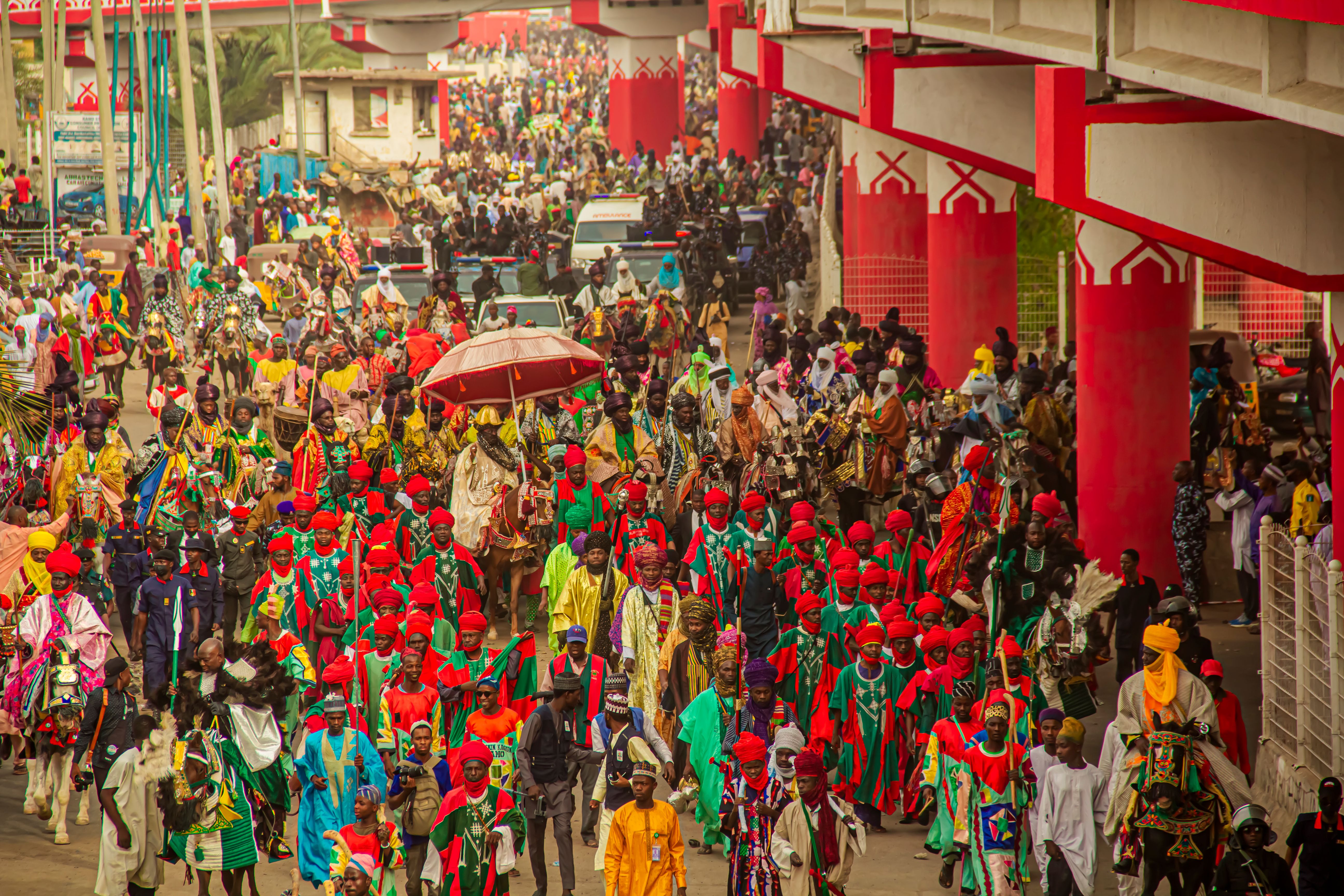 Vibrant Traditional African Parade in Urban Setting · Free Stock Photo