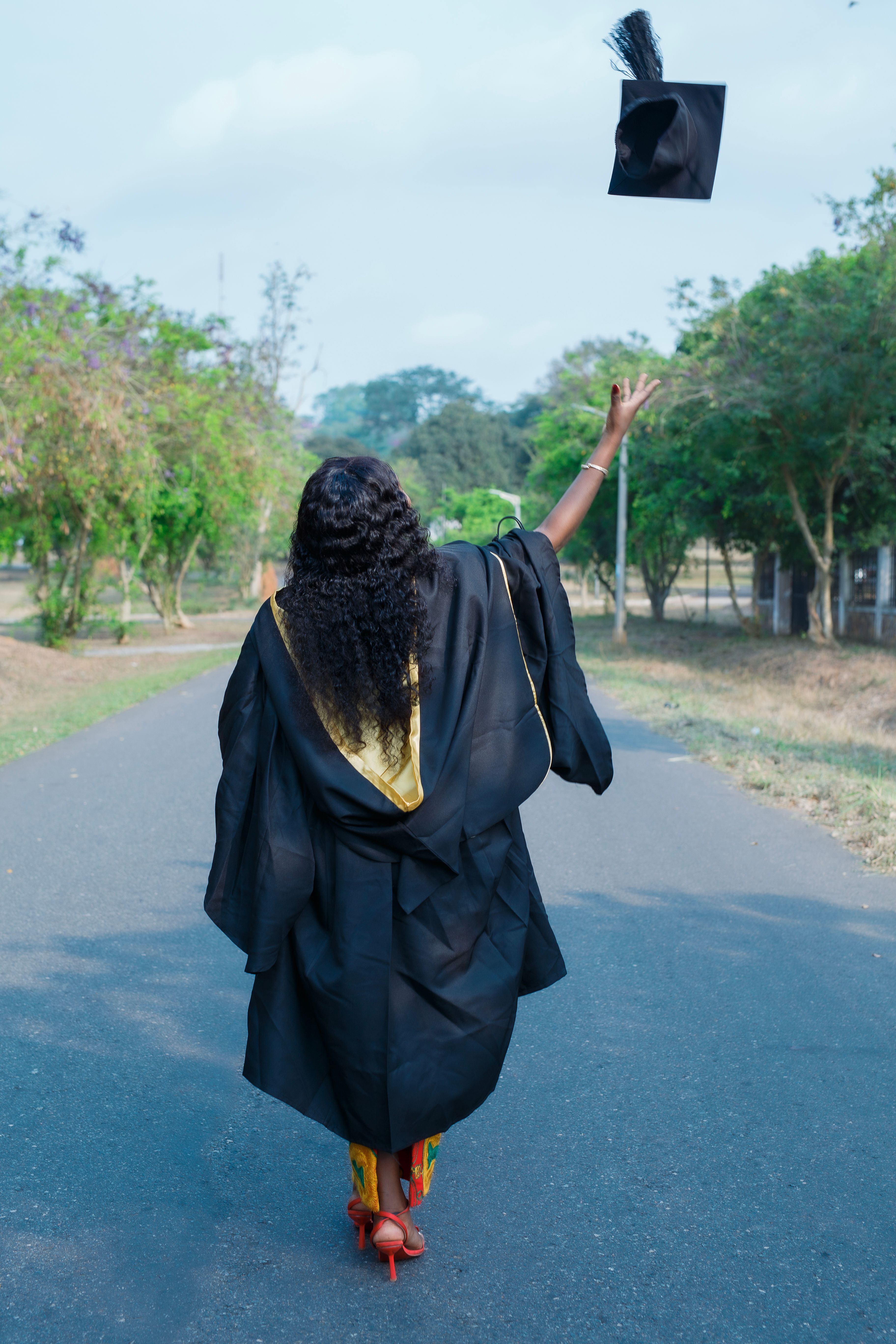 Celebratory Graduation Moment in Outdoor Setting · Free Stock Photo