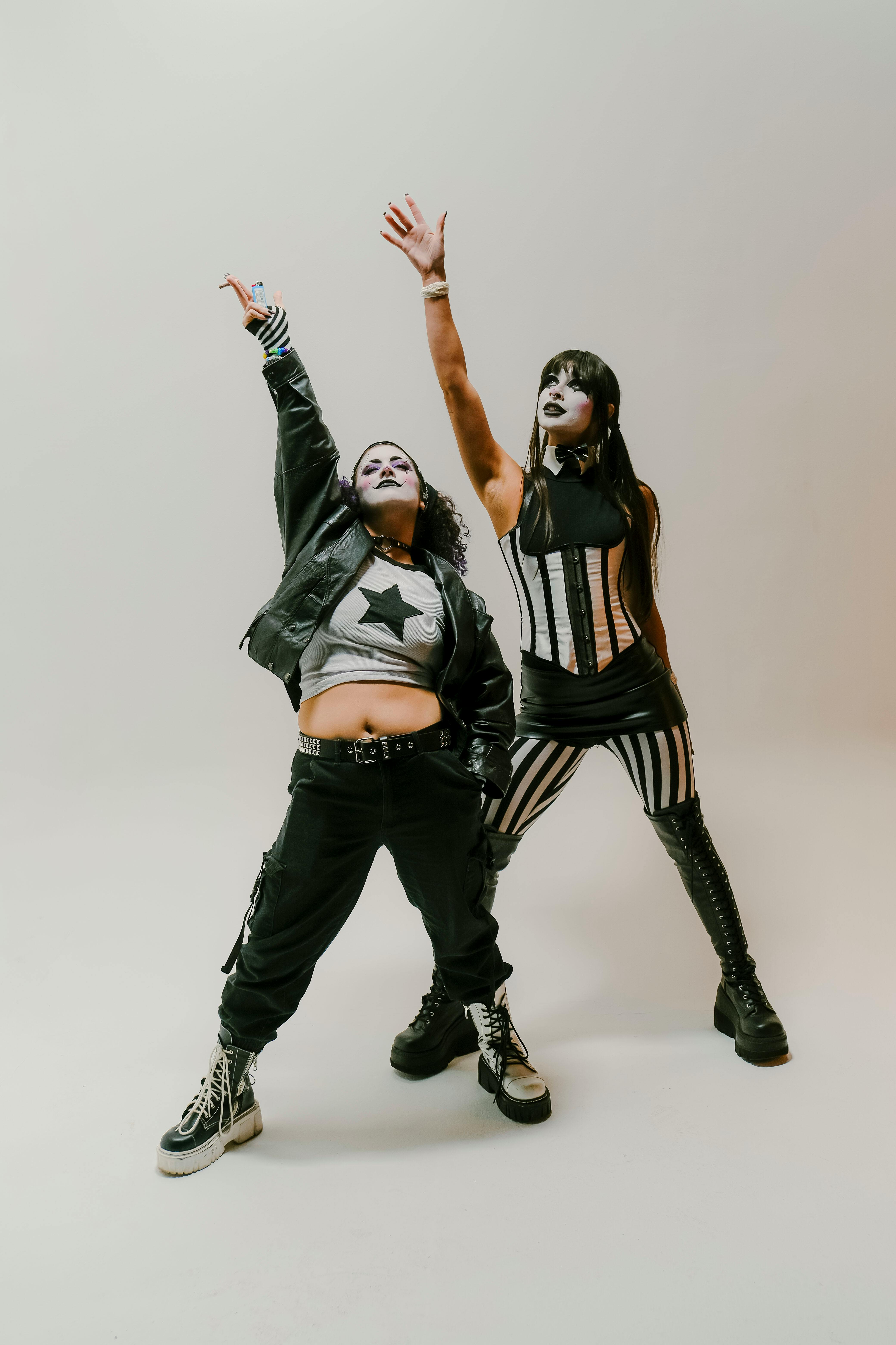 Dynamic Duo Striking a Bold Pose in Black and White · Free Stock Photo