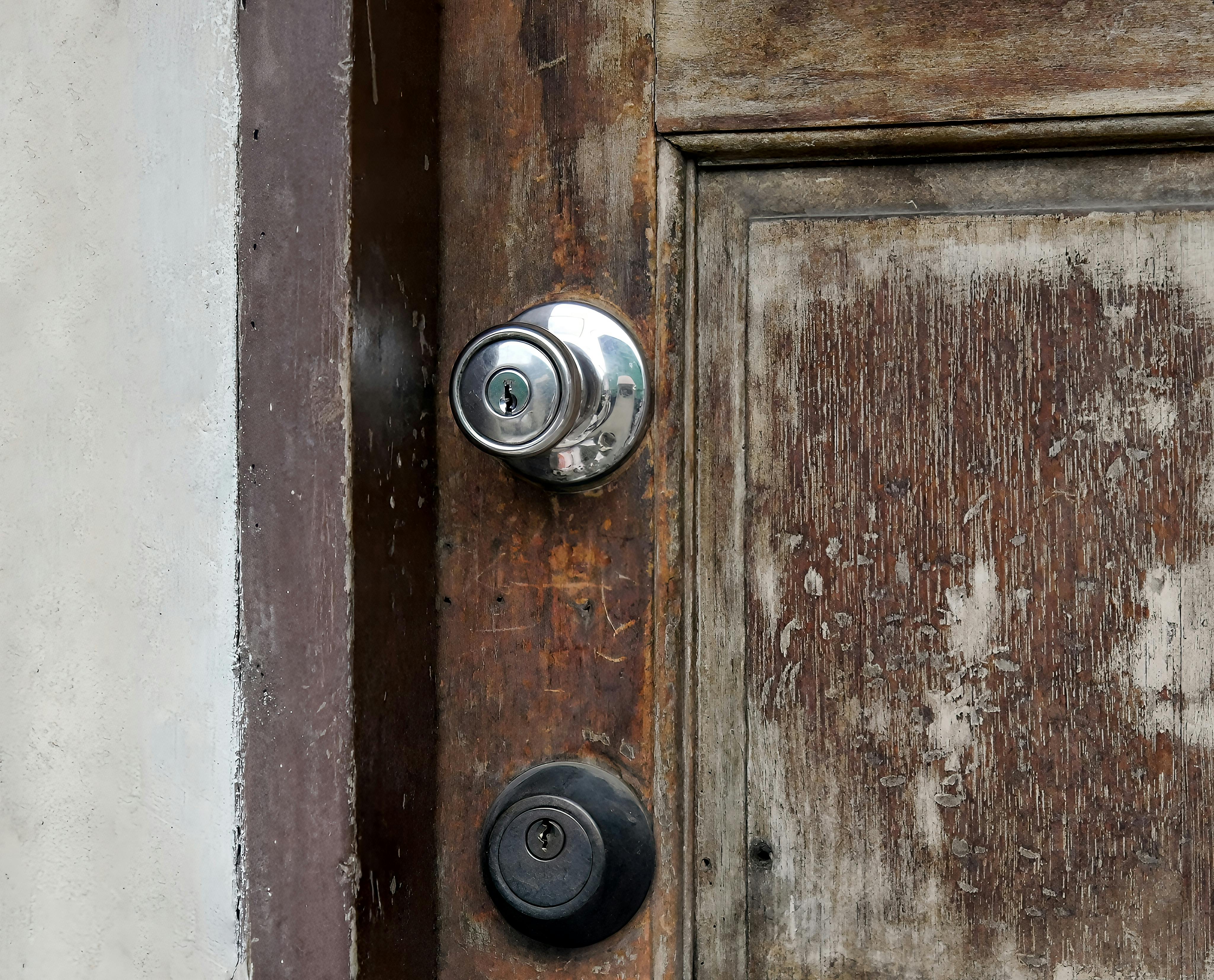 Rustic Worn Wooden Door with Metal Locks · Free Stock Photo