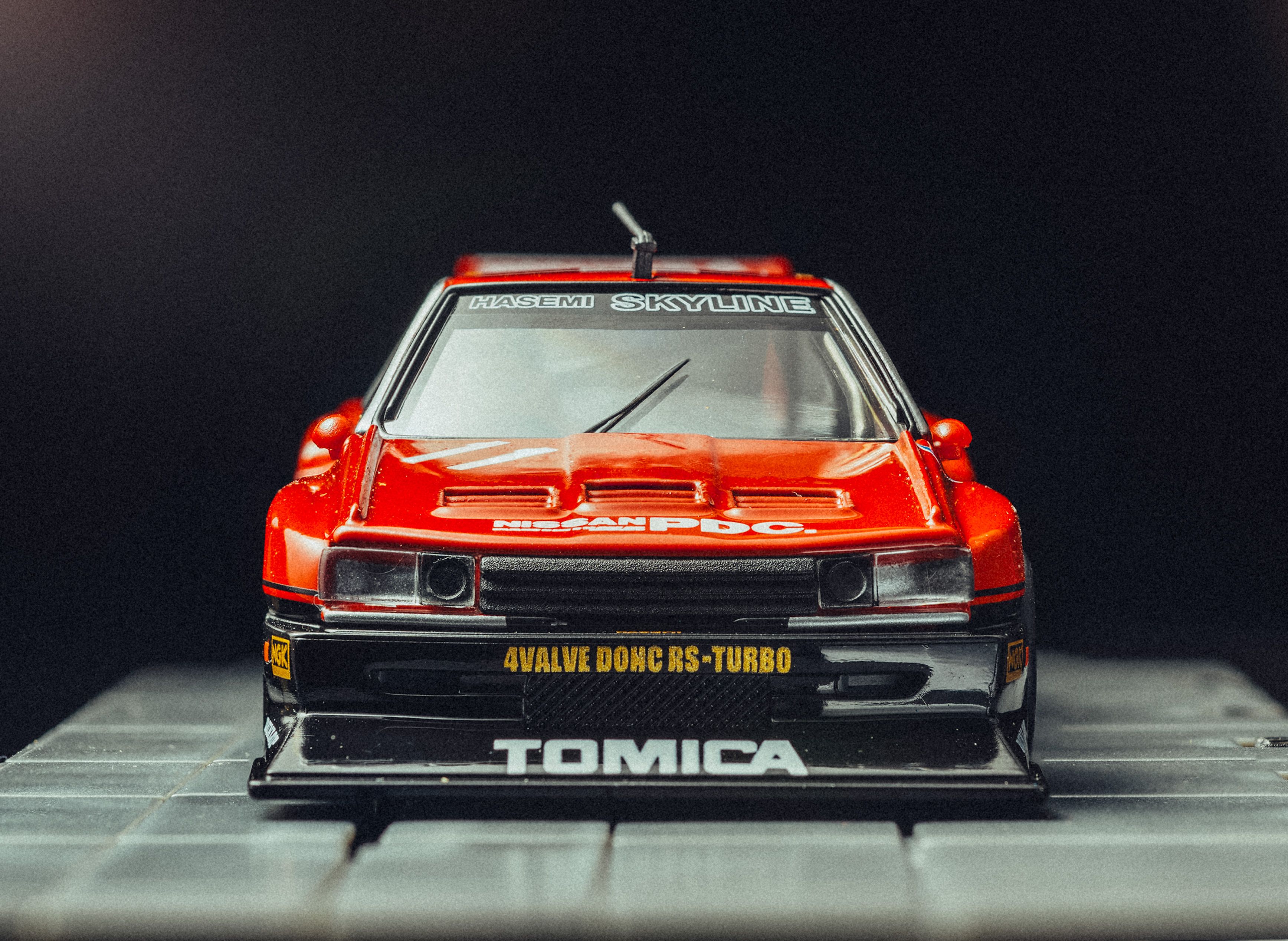Close-up of Red Model Car on Racing Track · Free Stock Photo