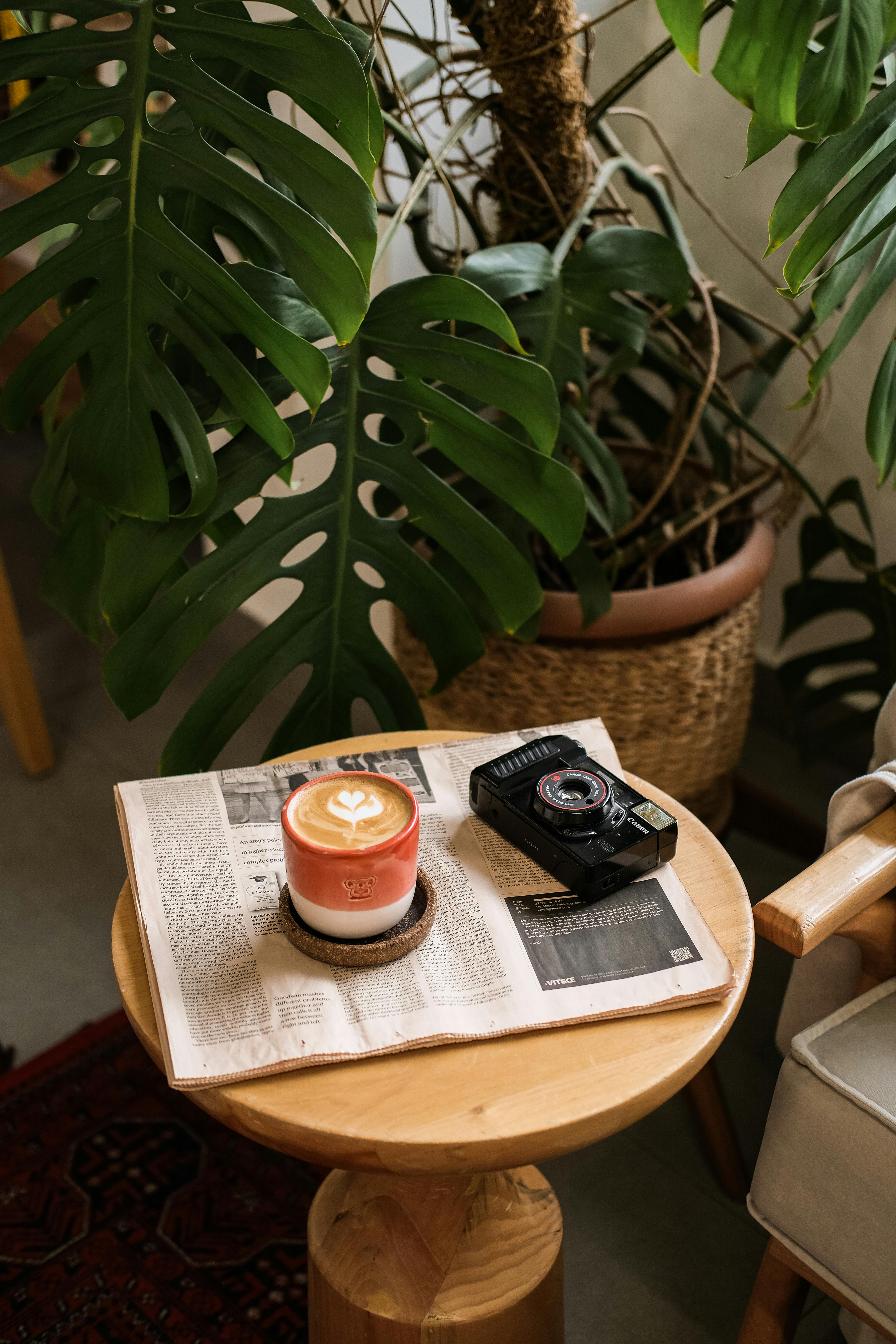 Cozy Coffee Table with Latte Art and Vintage Camera · Free Stock Photo