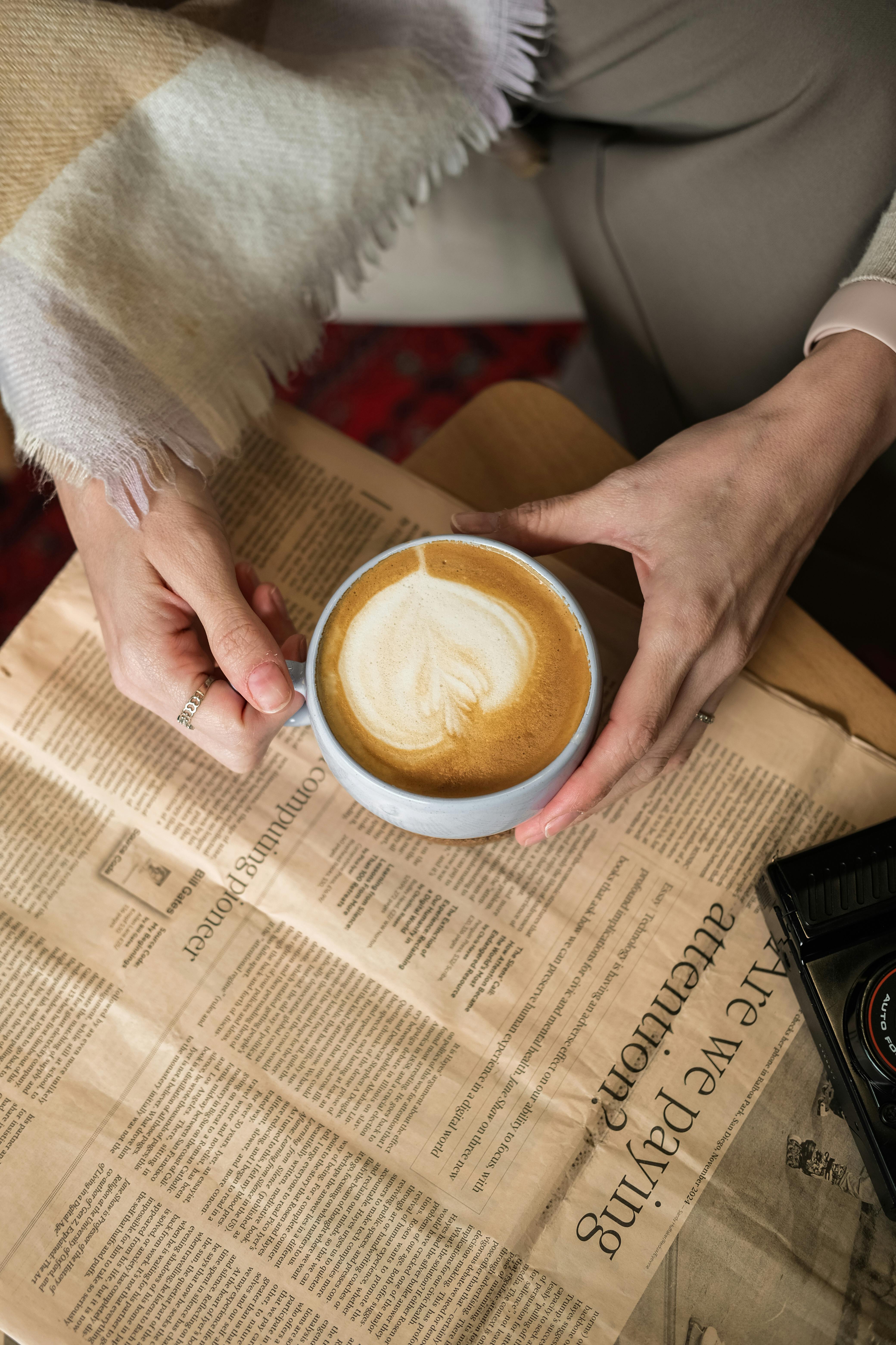 Elegant Coffee Break with Newspaper and Camera · Free Stock Photo