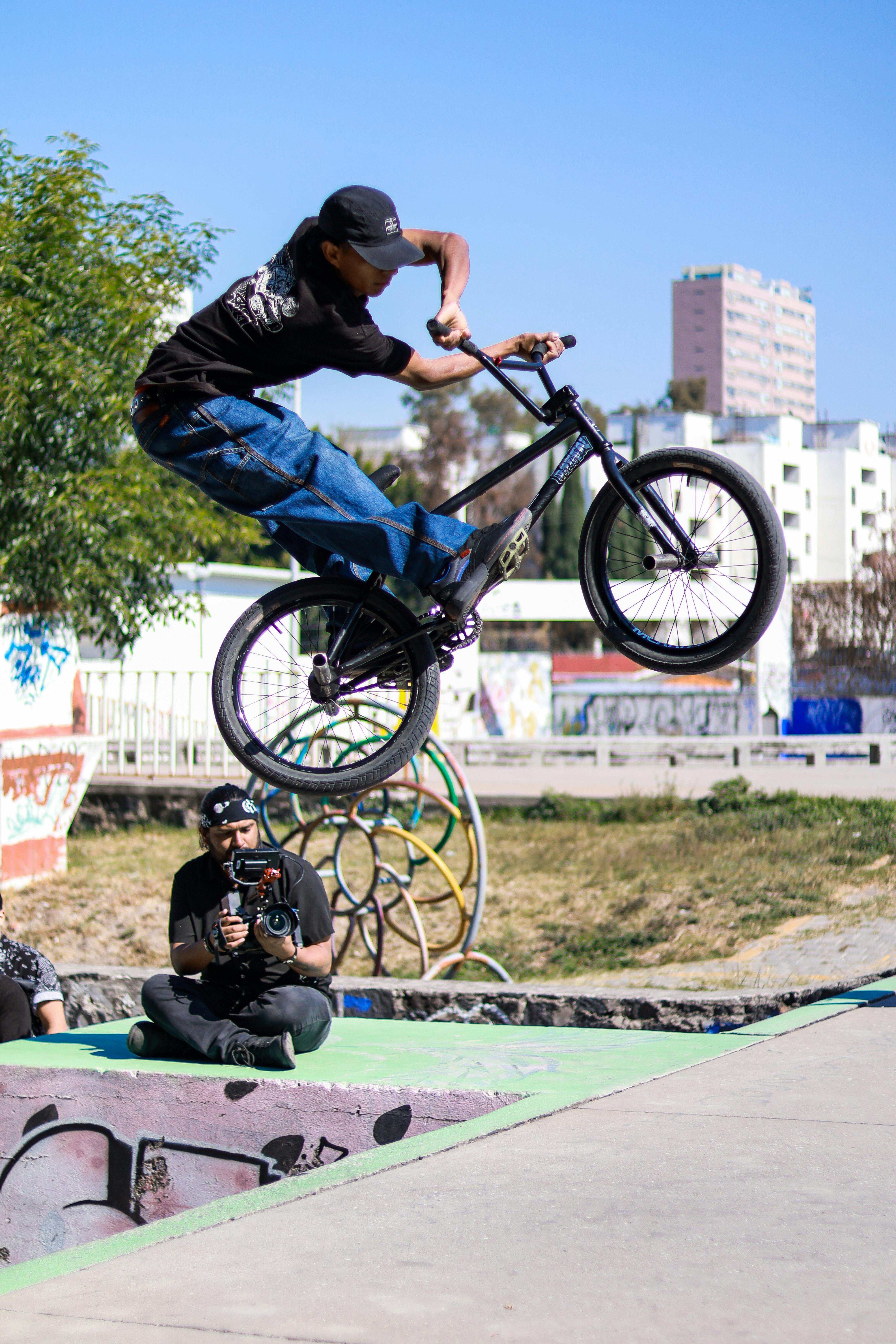 Dynamic BMX Stunt in Urban Skate Park · Free Stock Photo