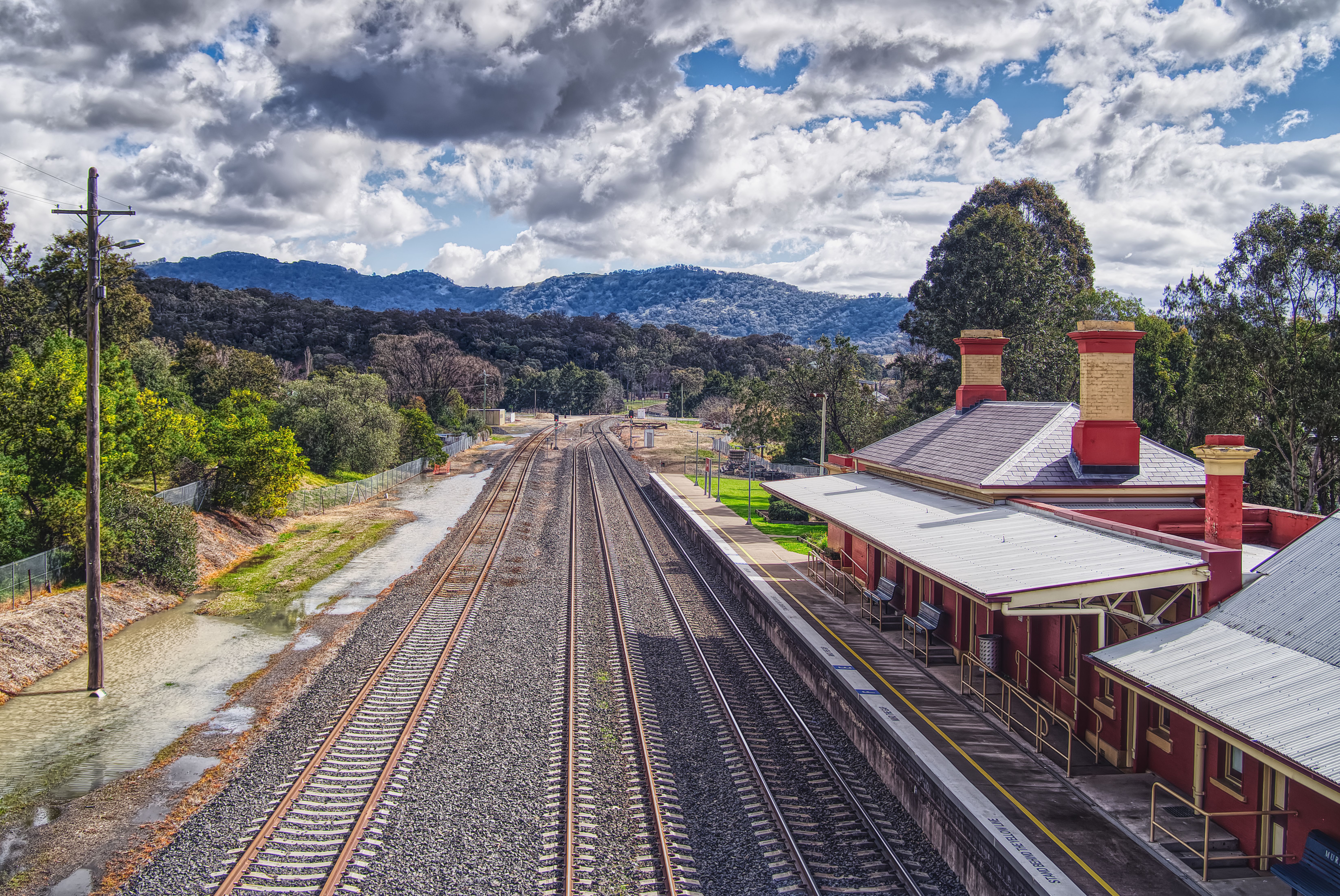 Scenic Railway Station in Mountain Landscape · Free Stock Photo