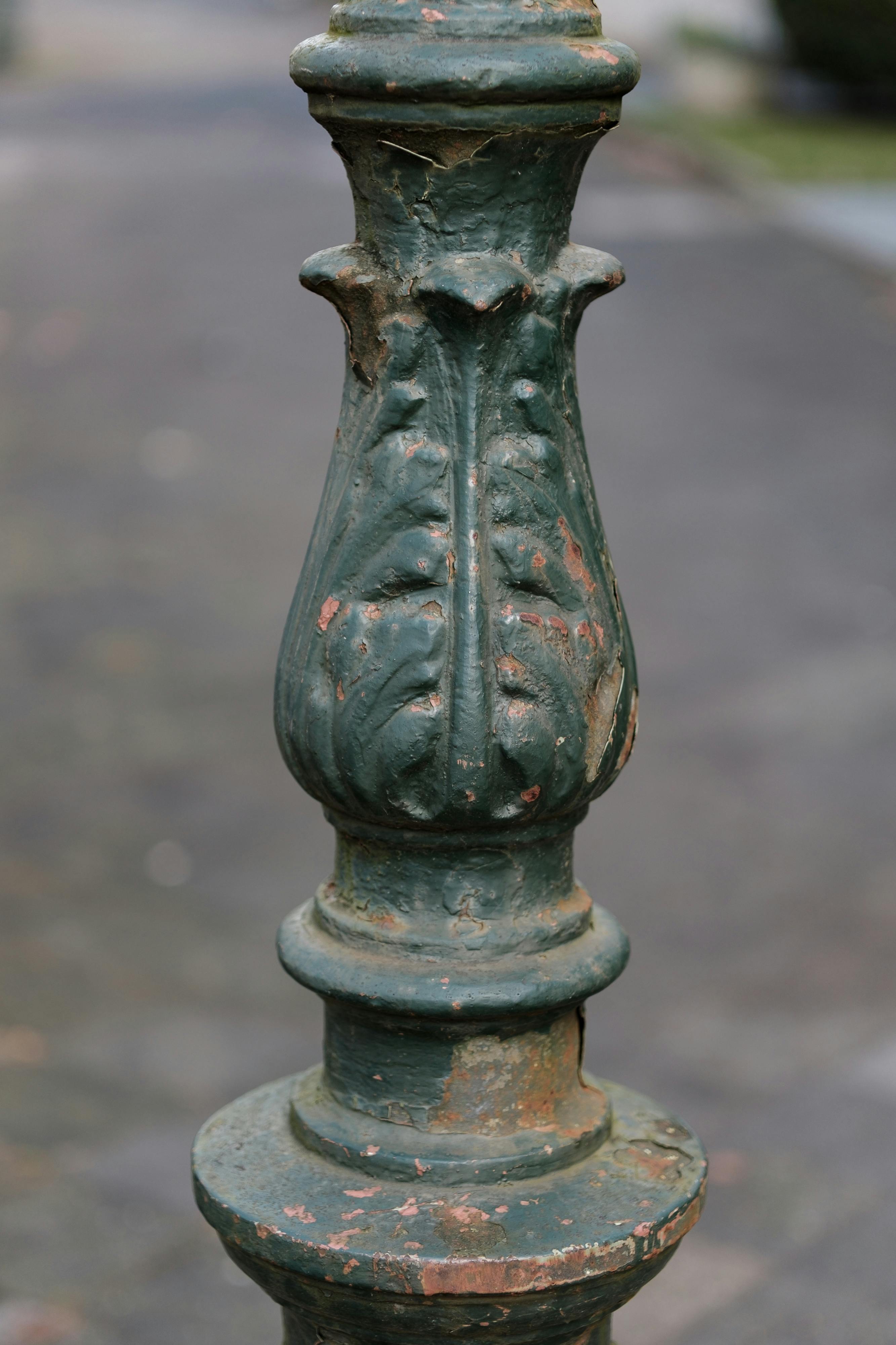 Close-up of a Weathered Ornamental Iron Post · Free Stock Photo