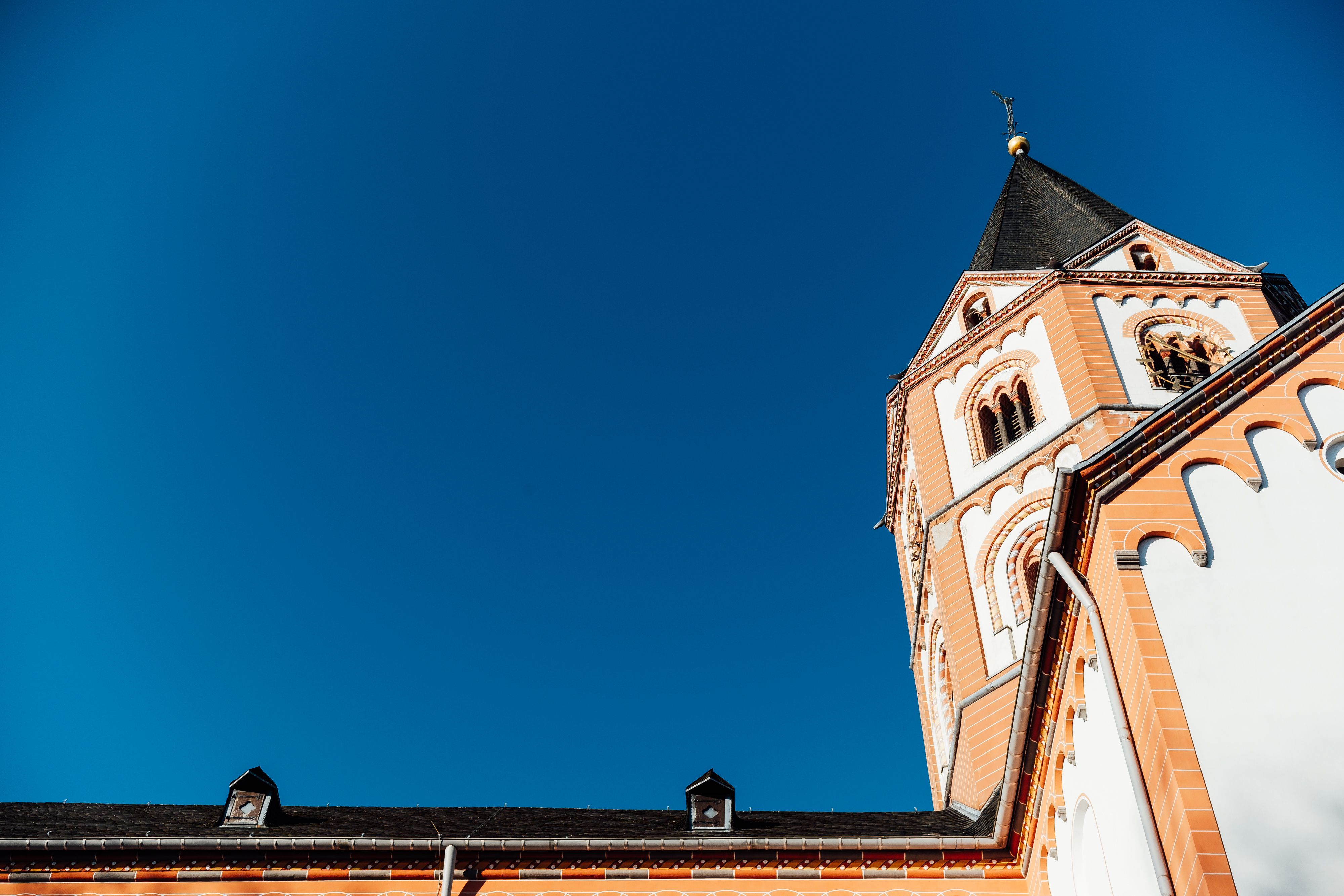 Old European Church Tower Against Blue Sky · Free Stock Photo