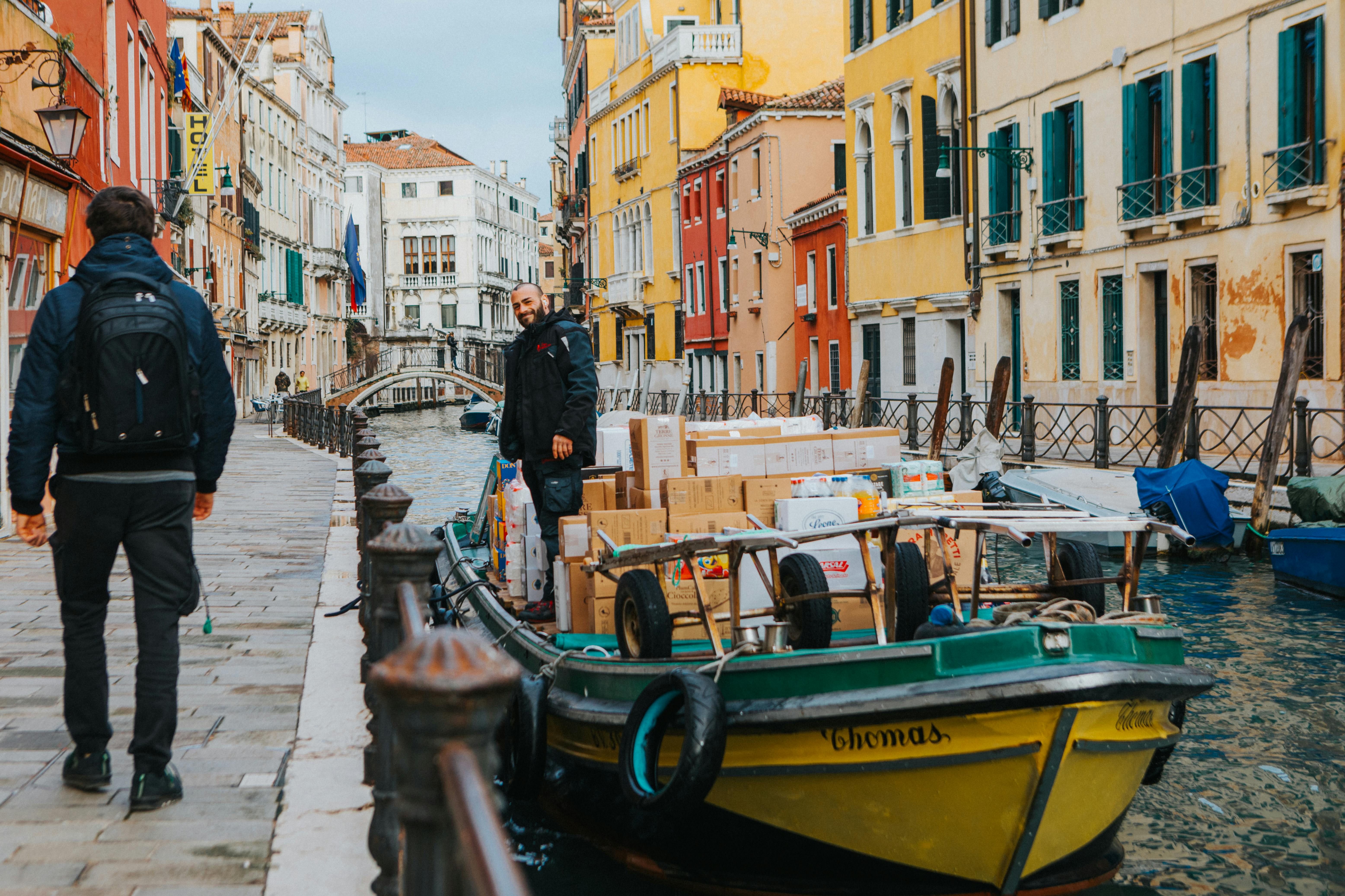 Canal Transport Scene in Vibrant Venice Streets · Free Stock Photo