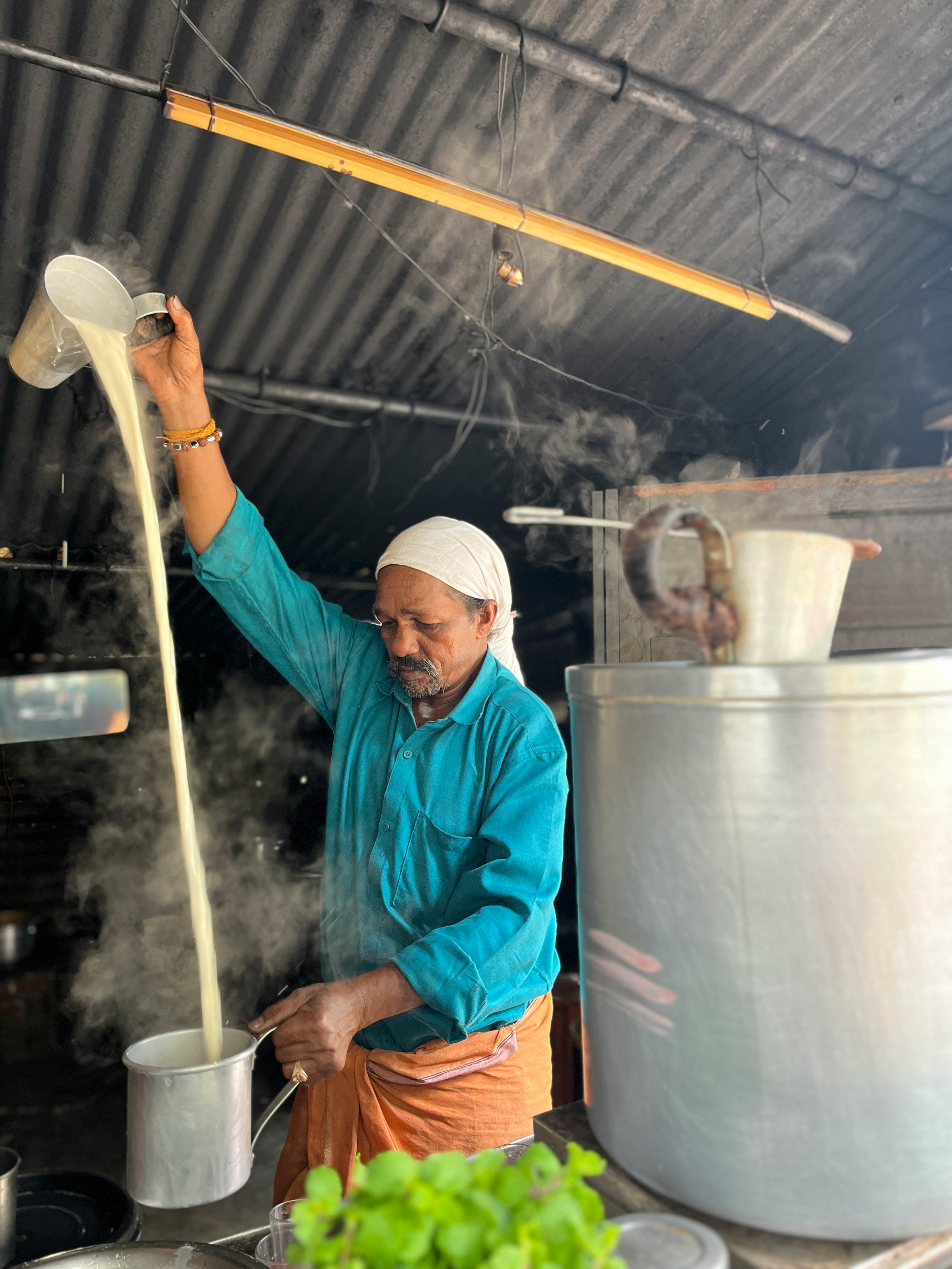 Indian Street Vendor Pouring Chai Tea · Free Stock Photo