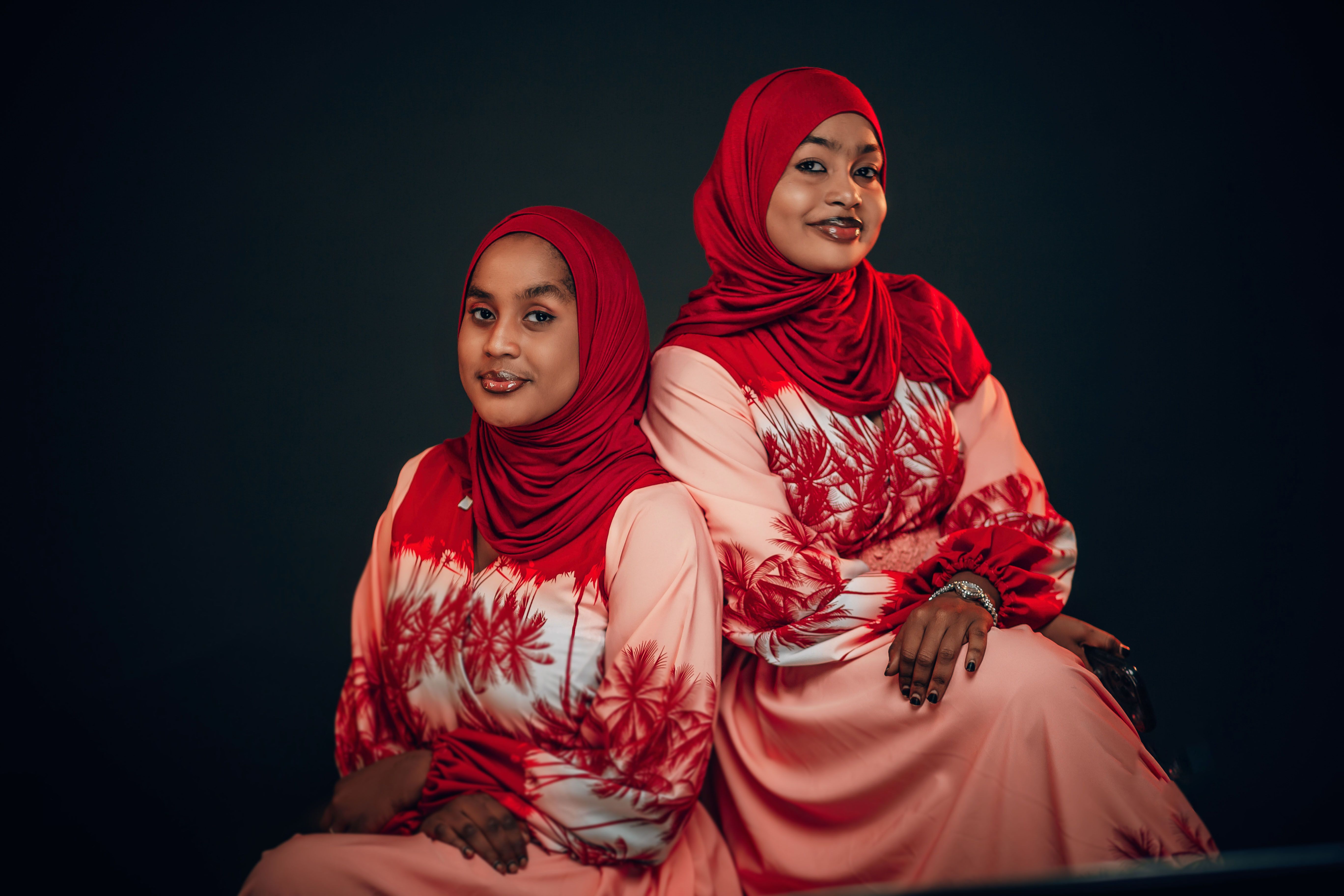 Elegant Portrait of Women in Red Hijabs · Free Stock Photo