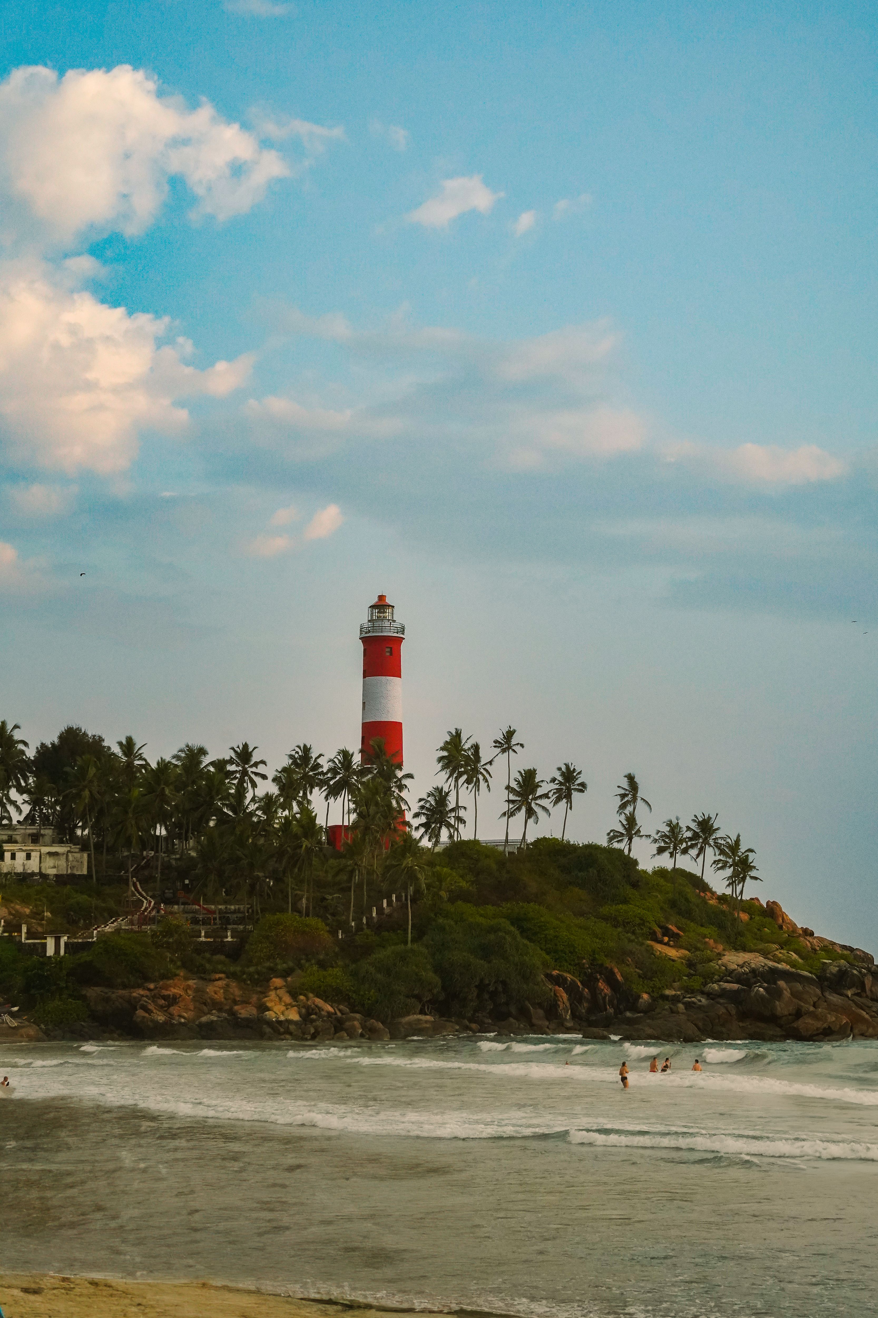 Picturesque lighthouse on tropical coastline · Free Stock Photo
