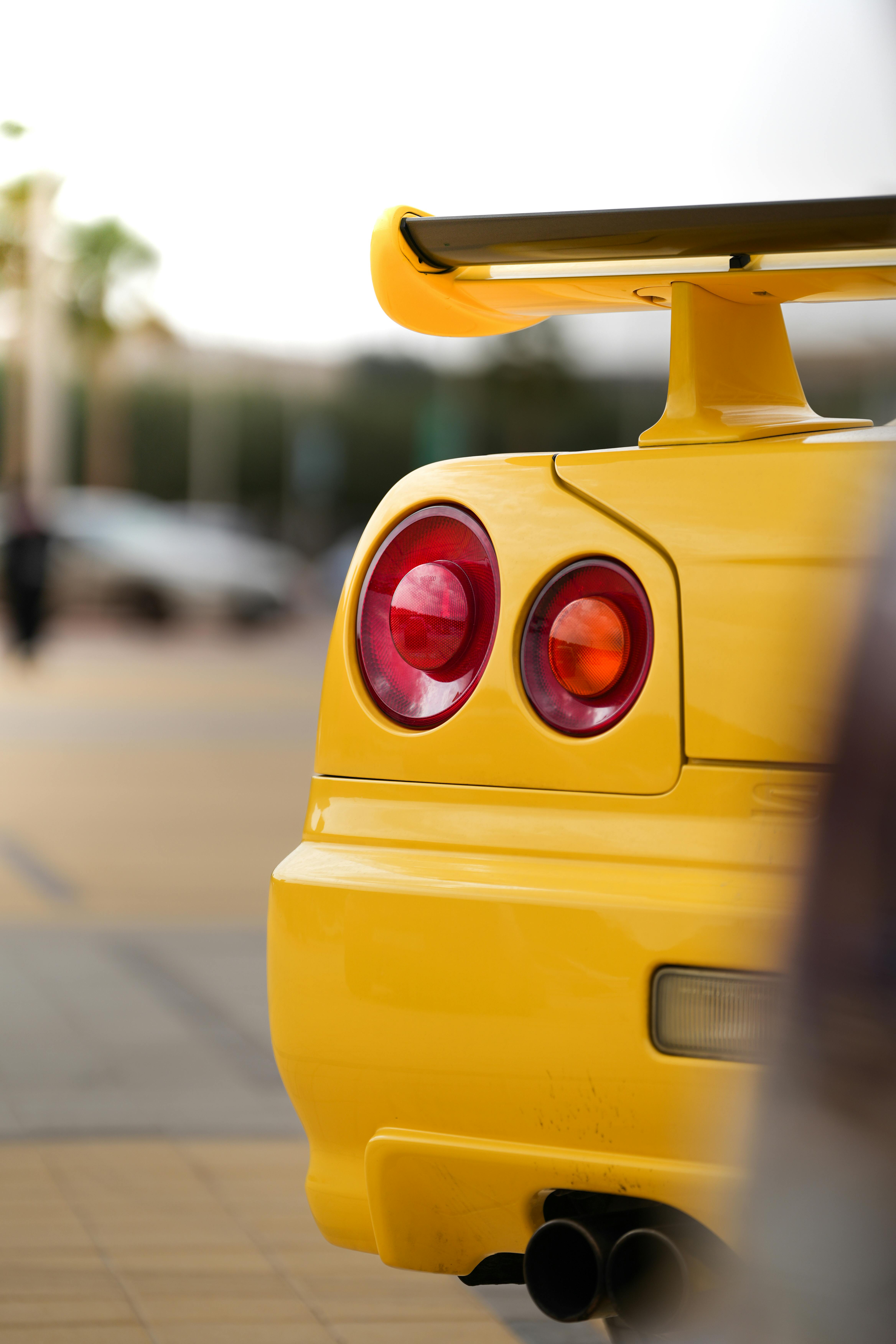 Yellow Sports Car Rear with Spoiler Close-Up · Free Stock Photo
