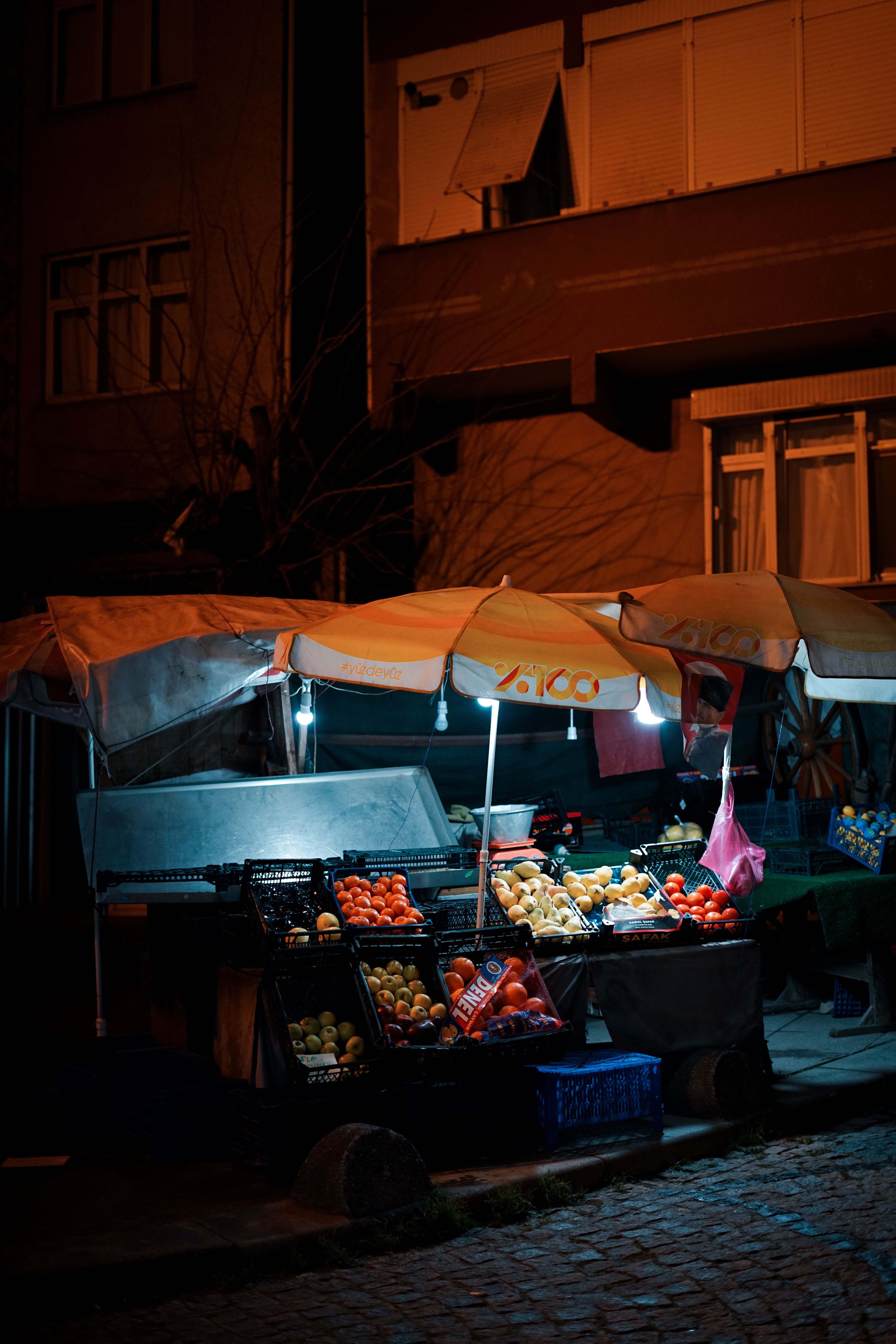 Nighttime Urban Street Market Stall with Fruits · Free Stock Photo