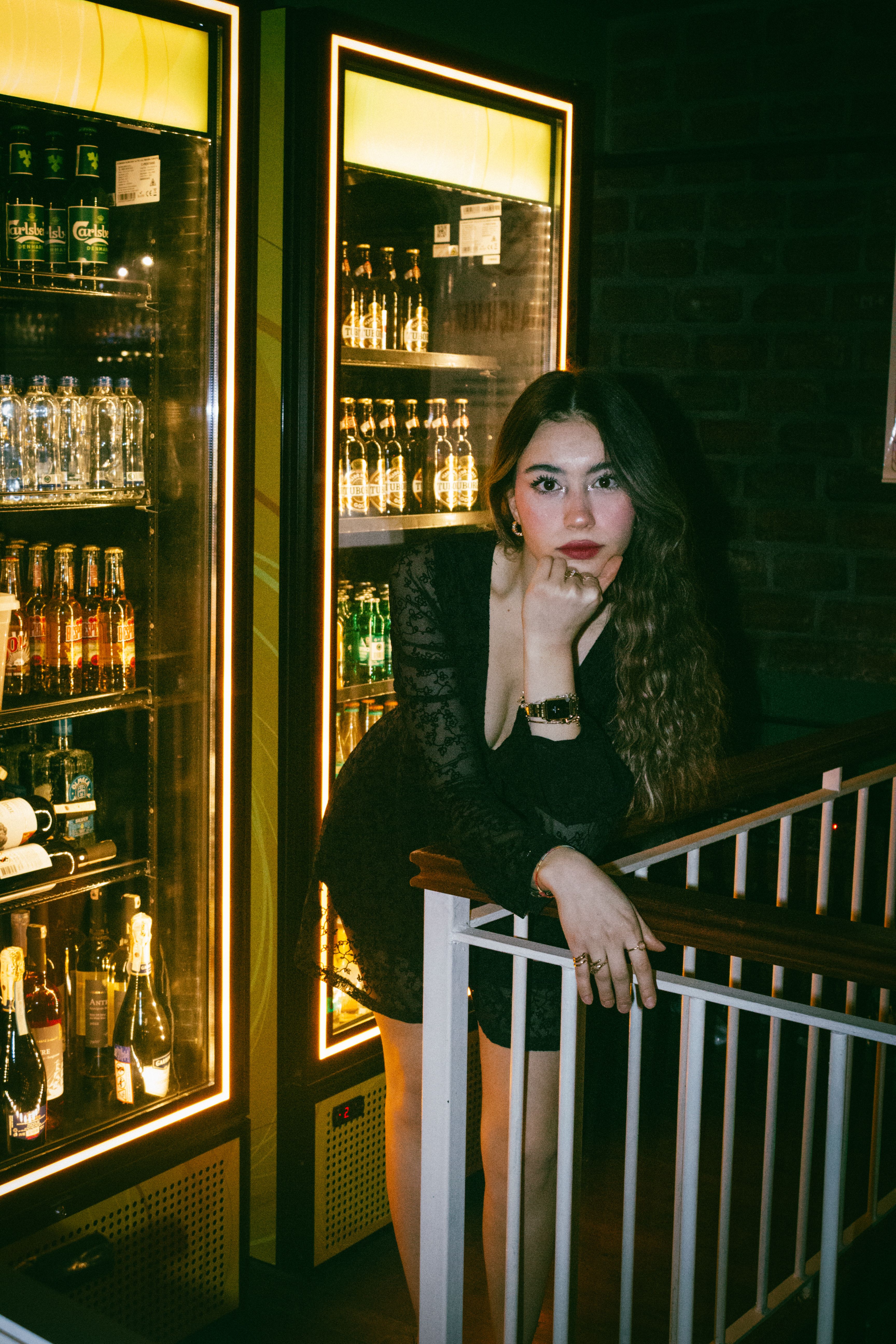 Woman Posing Elegantly in Bar Setting · Free Stock Photo