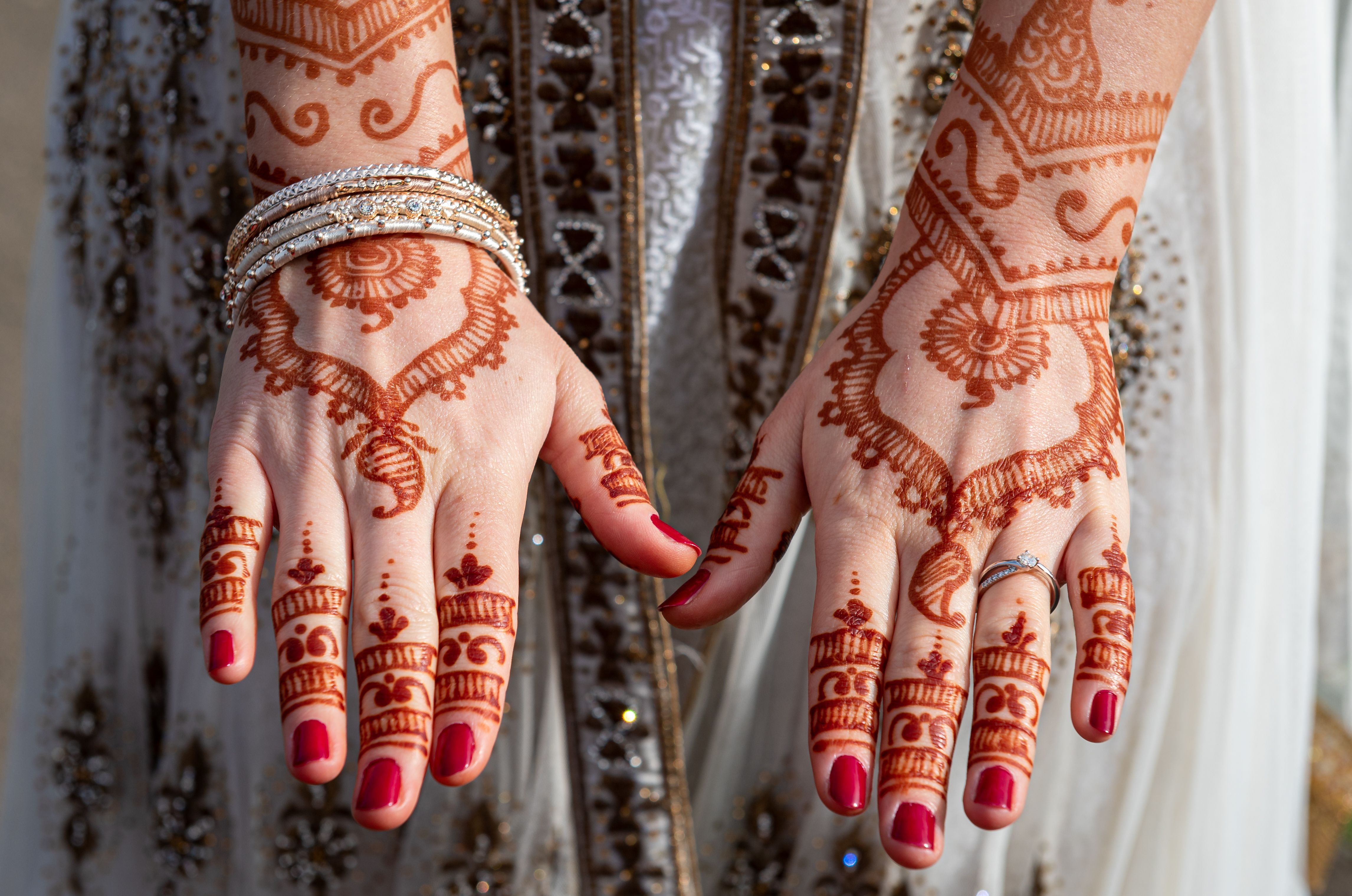 Intricate Bridal Henna on Hands With Jewelry · Free Stock Photo