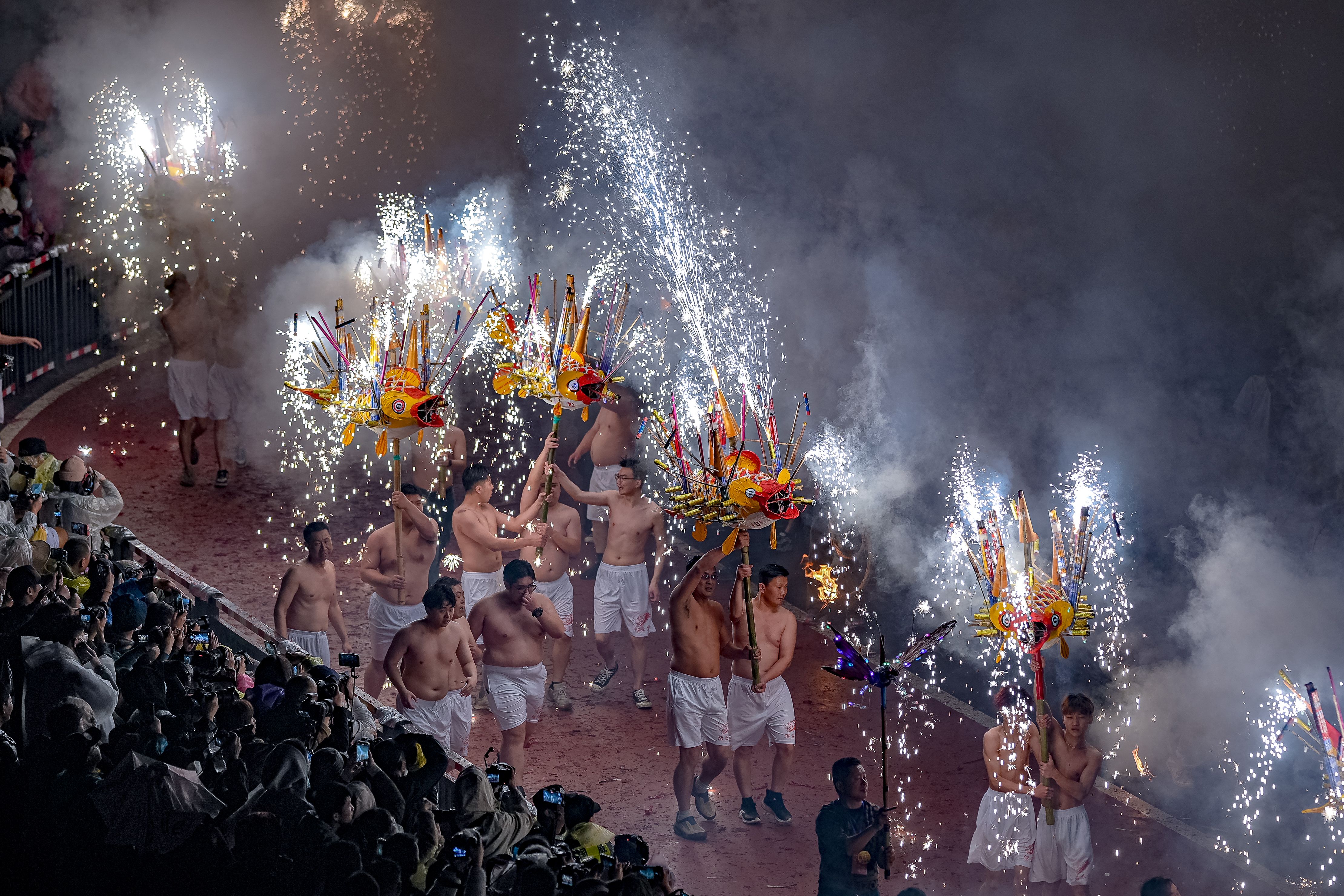 Vibrant Festival Parade with Fireworks Display · Free Stock Photo