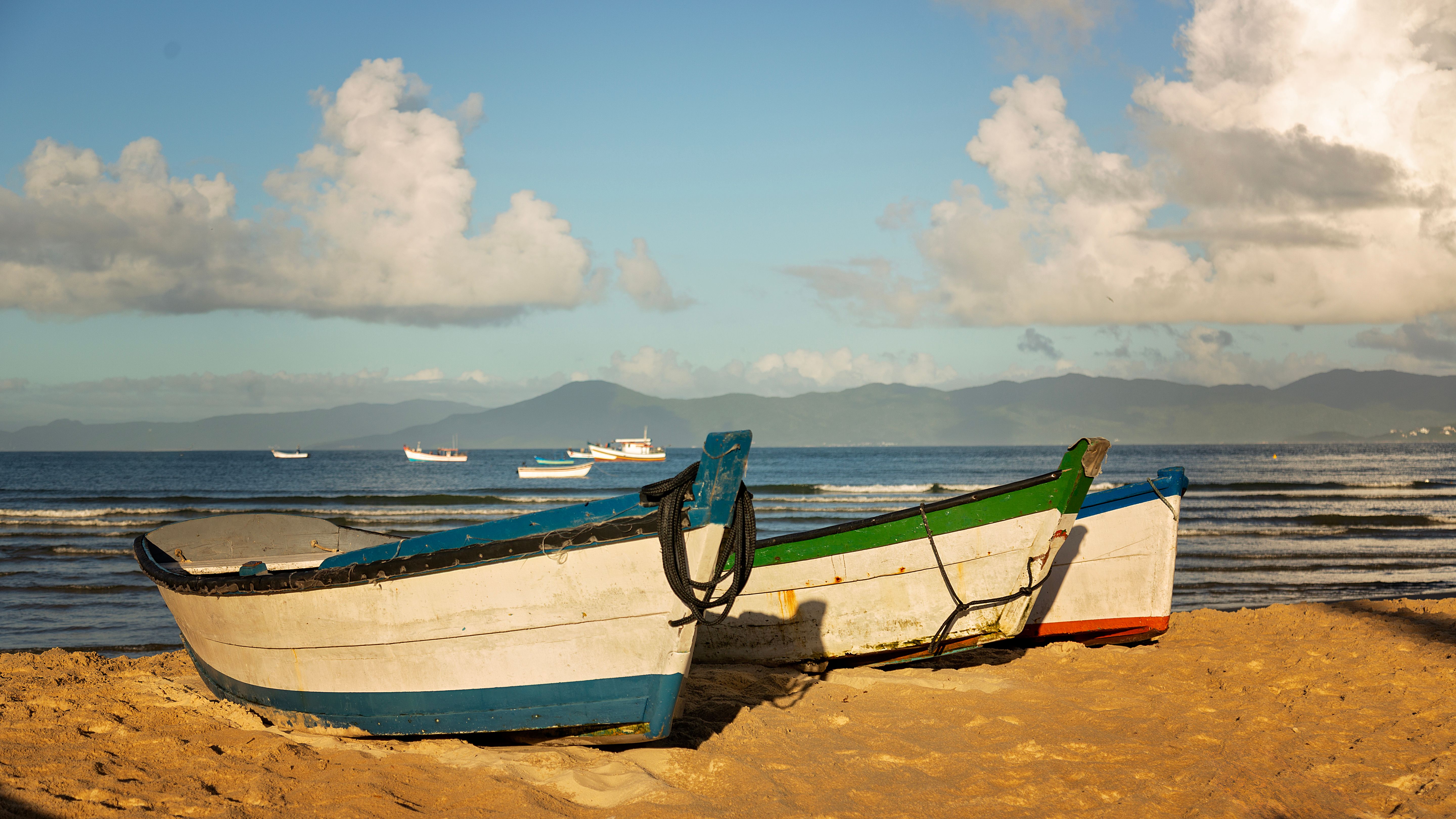 Scenic Beach View with Boats at Sunrise · Free Stock Photo