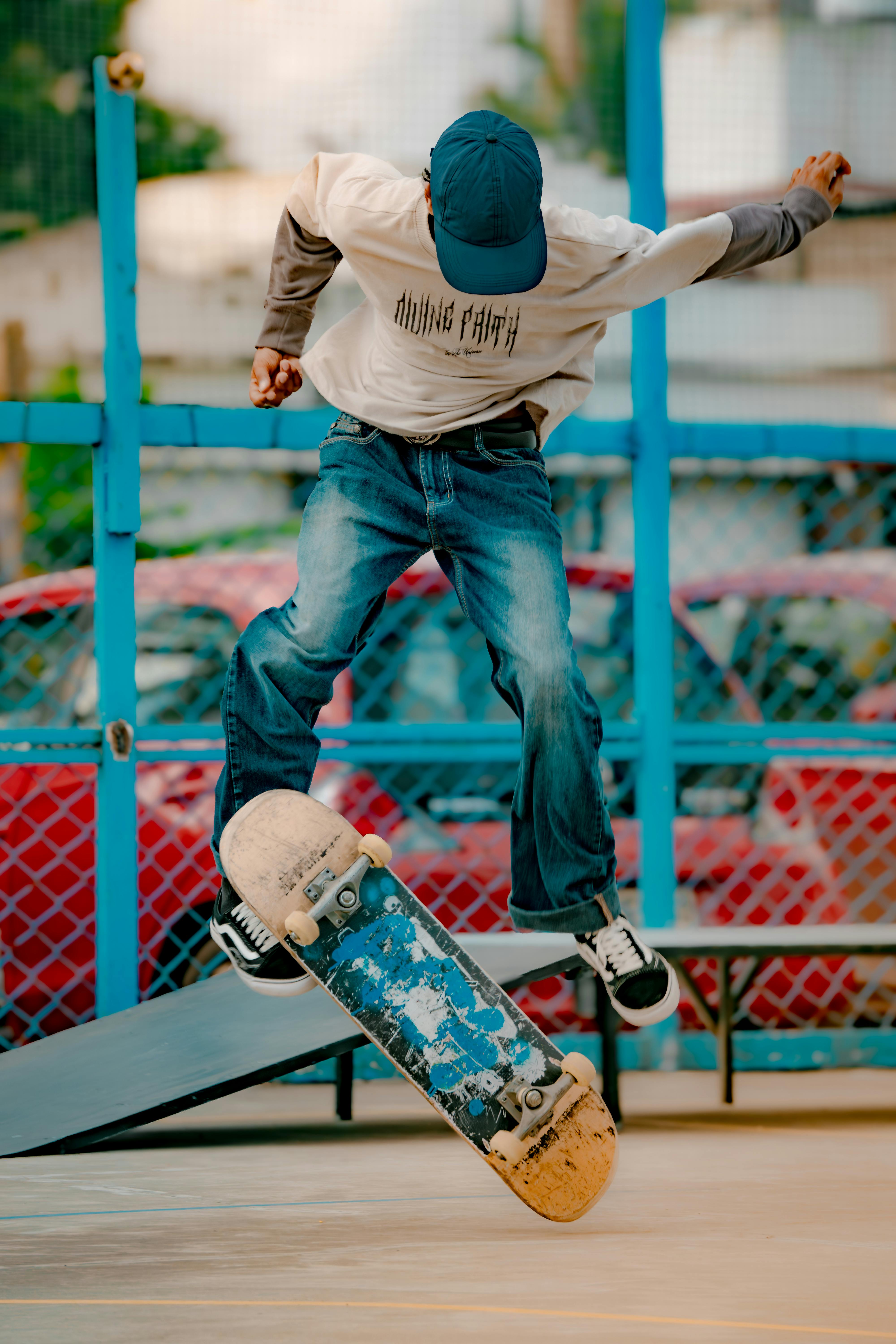 Dynamic Skateboard Jump in Urban Skatepark · Free Stock Photo