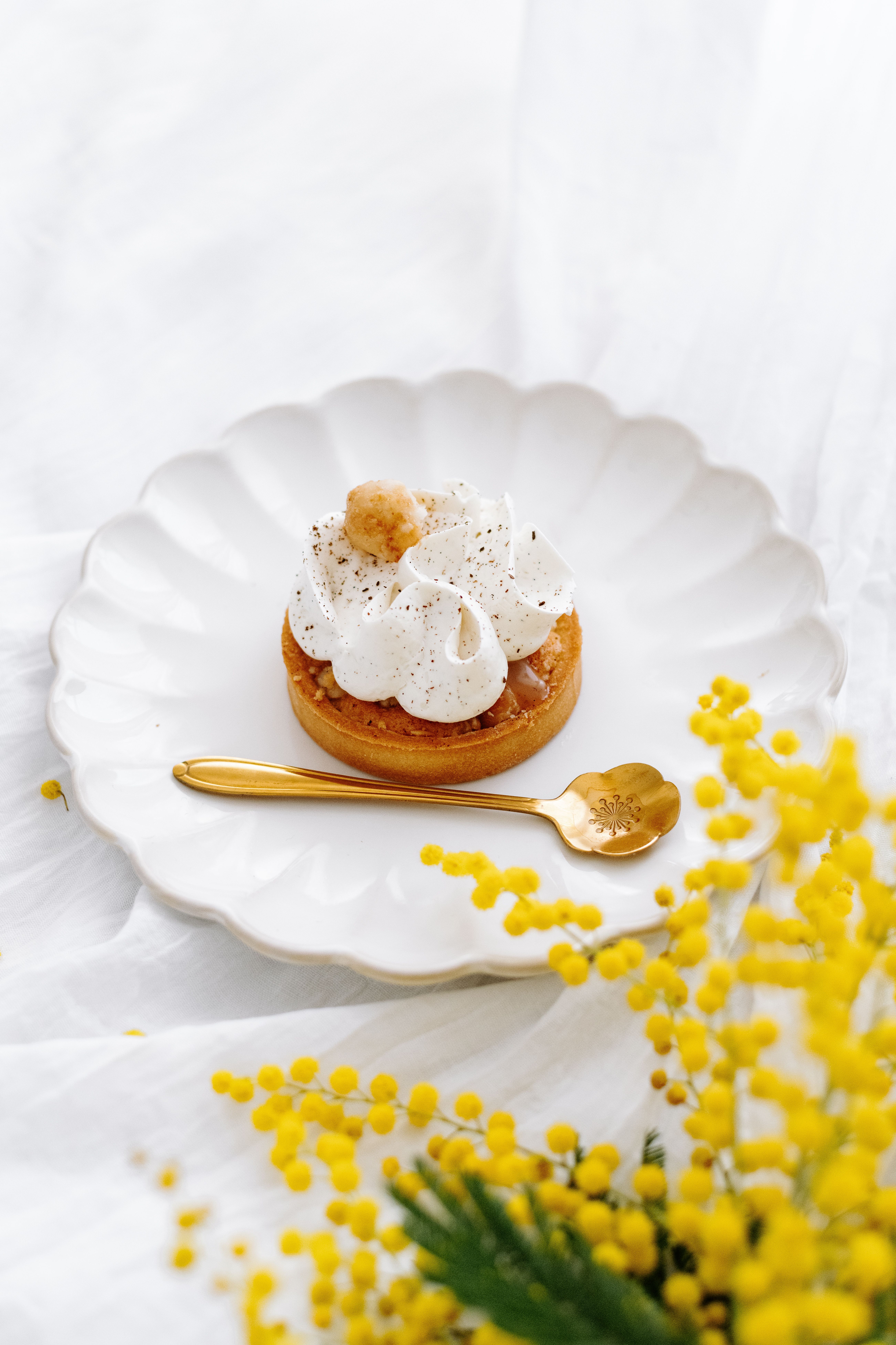 Delicious French Pastry with Whipped Cream and Mimosa · Free Stock Photo