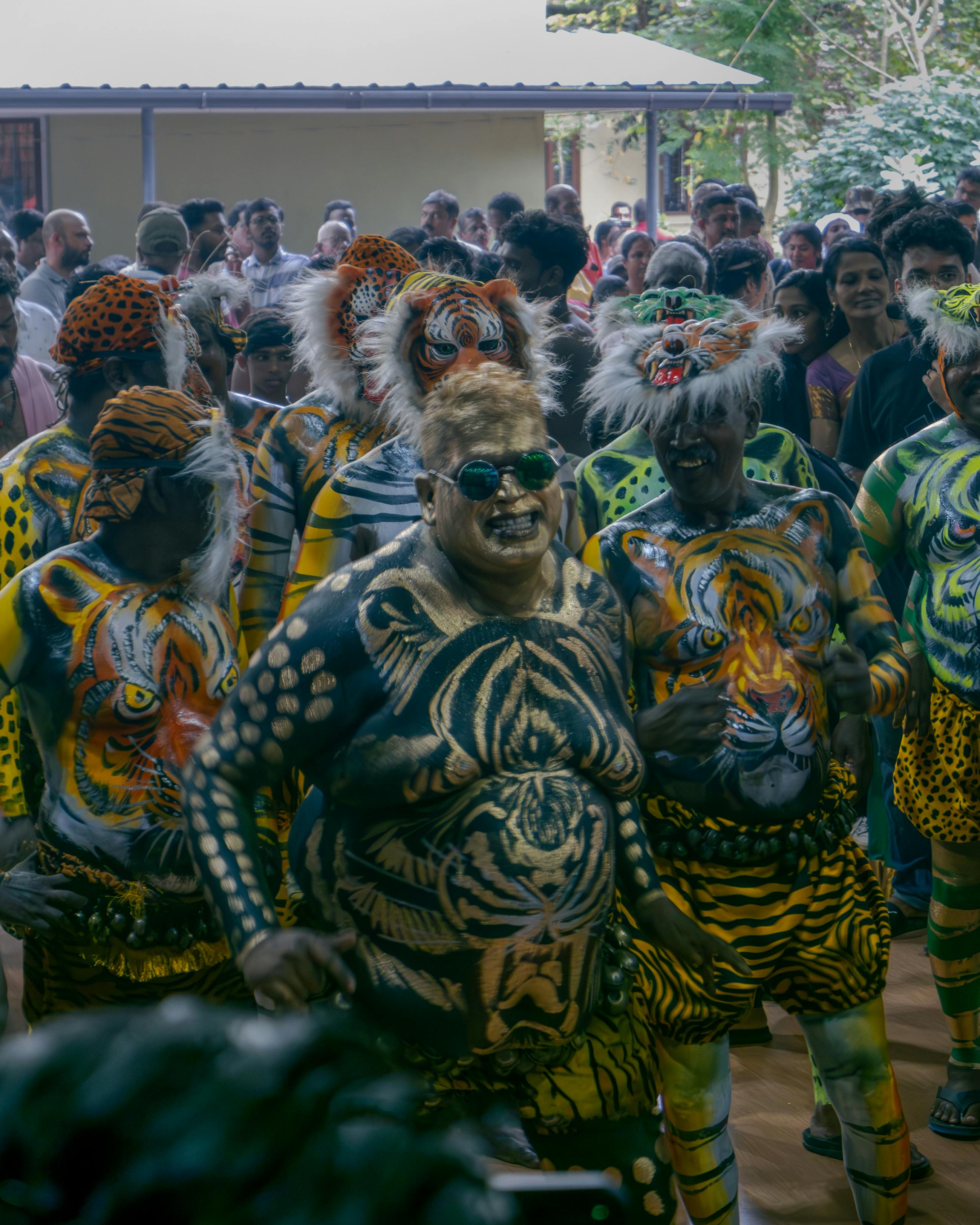 Vibrant Cultural Dance with Tiger Body Paint · Free Stock Photo