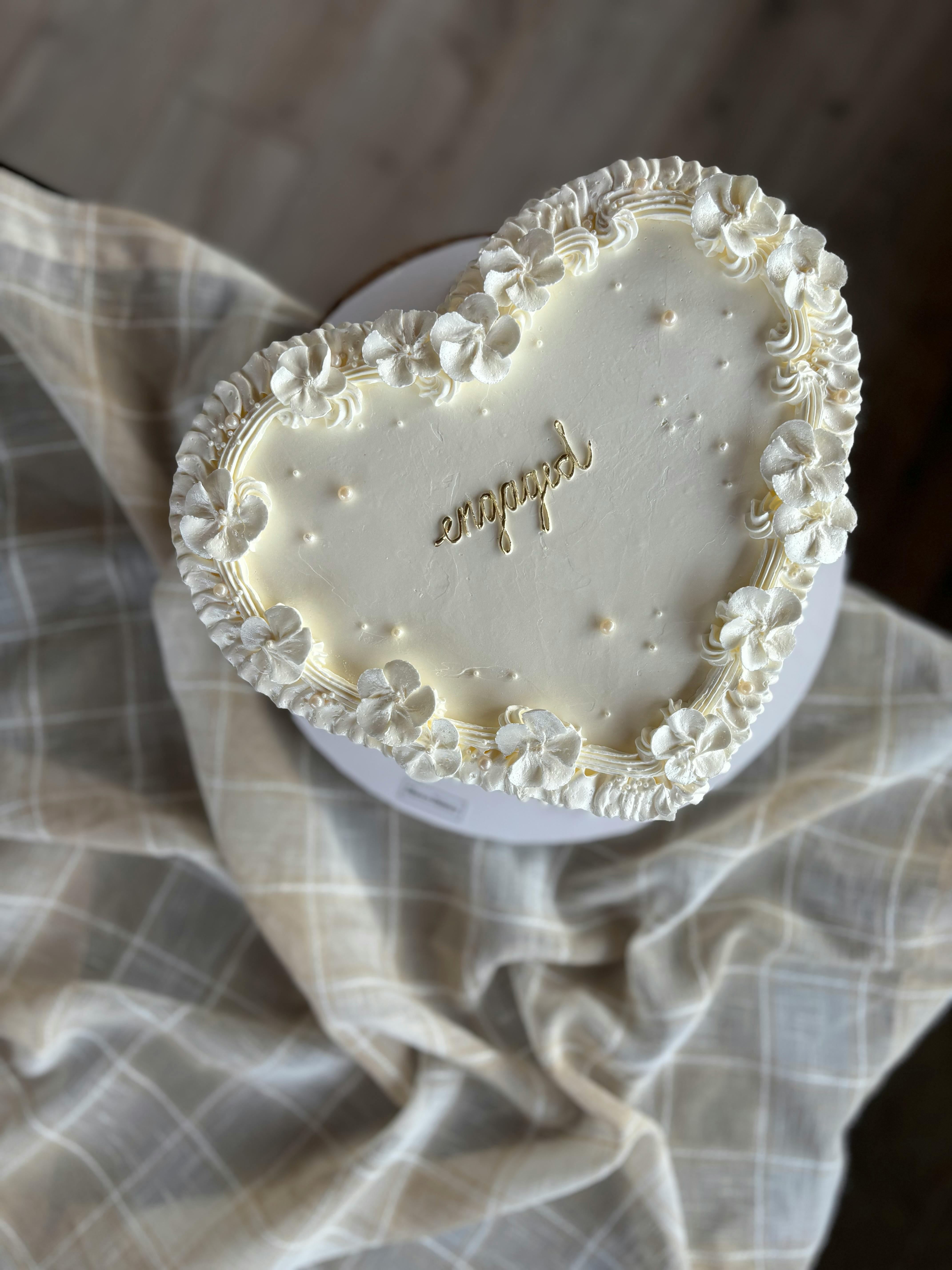 Heart-Shaped Engagement Cake with Floral Decor · Free Stock Photo