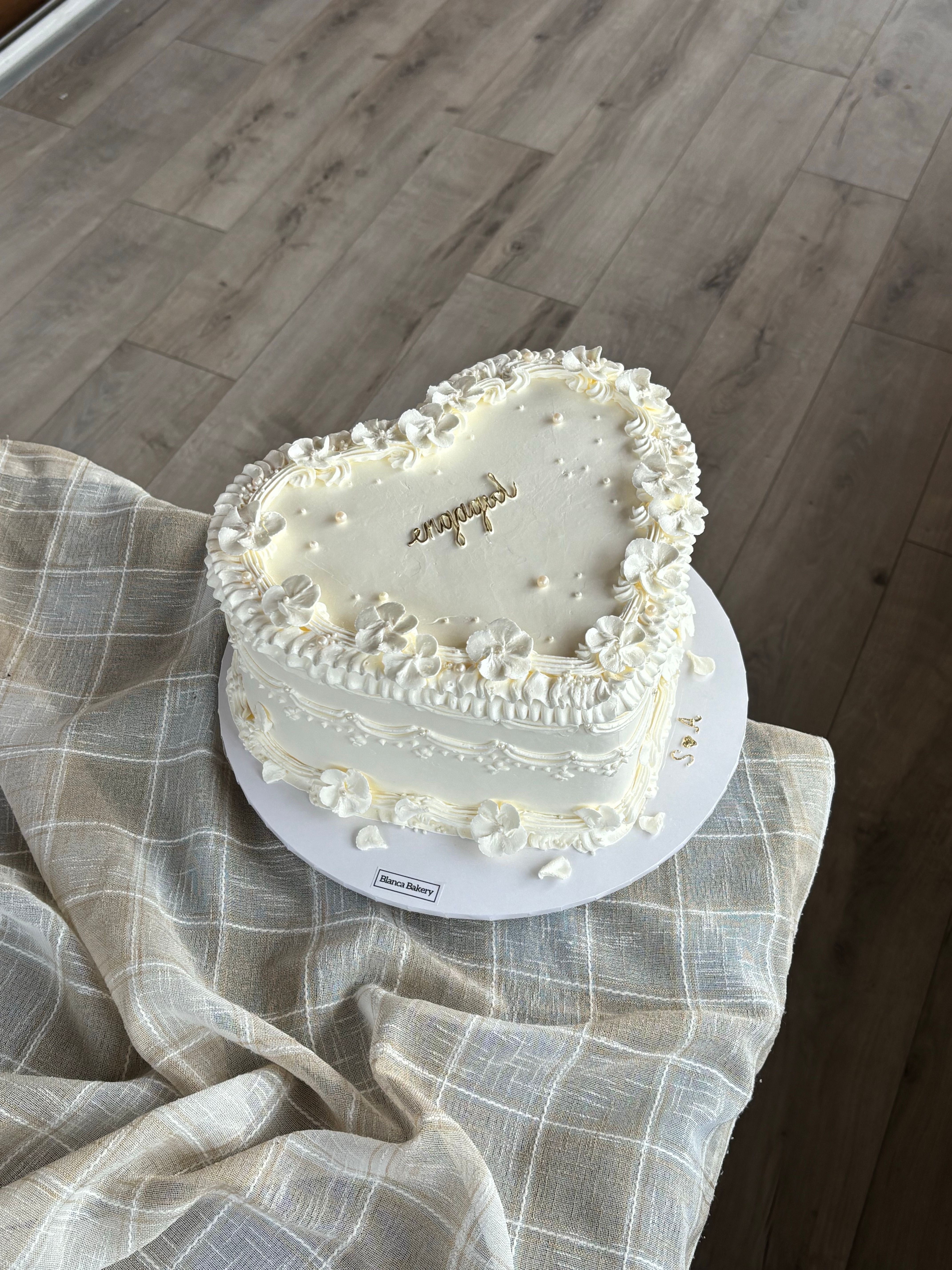 Heart-Shaped White Cake on a Tablecloth · Free Stock Photo