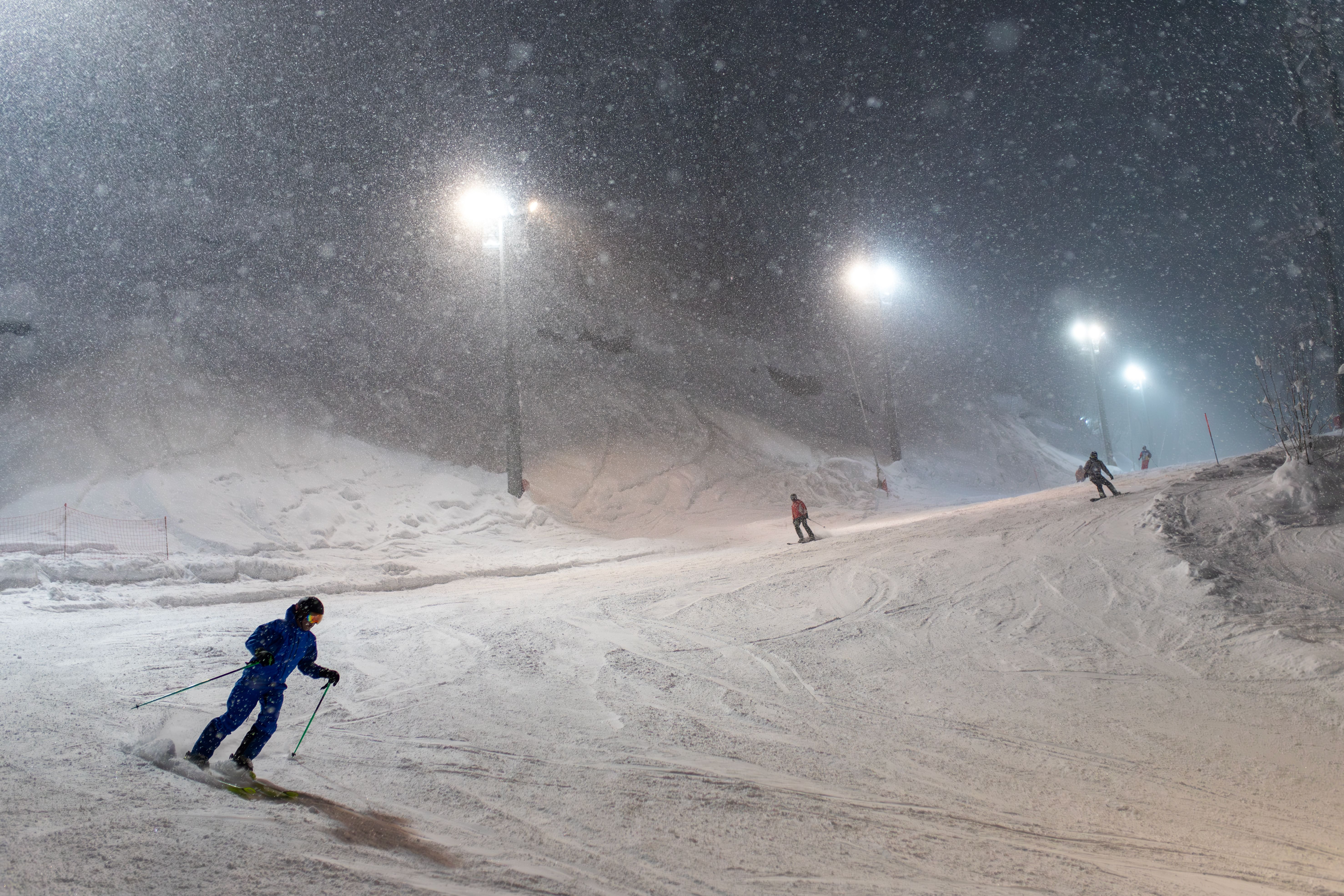Night Skiing on Snowy Mountains Lit by Lanterns · Free Stock Photo