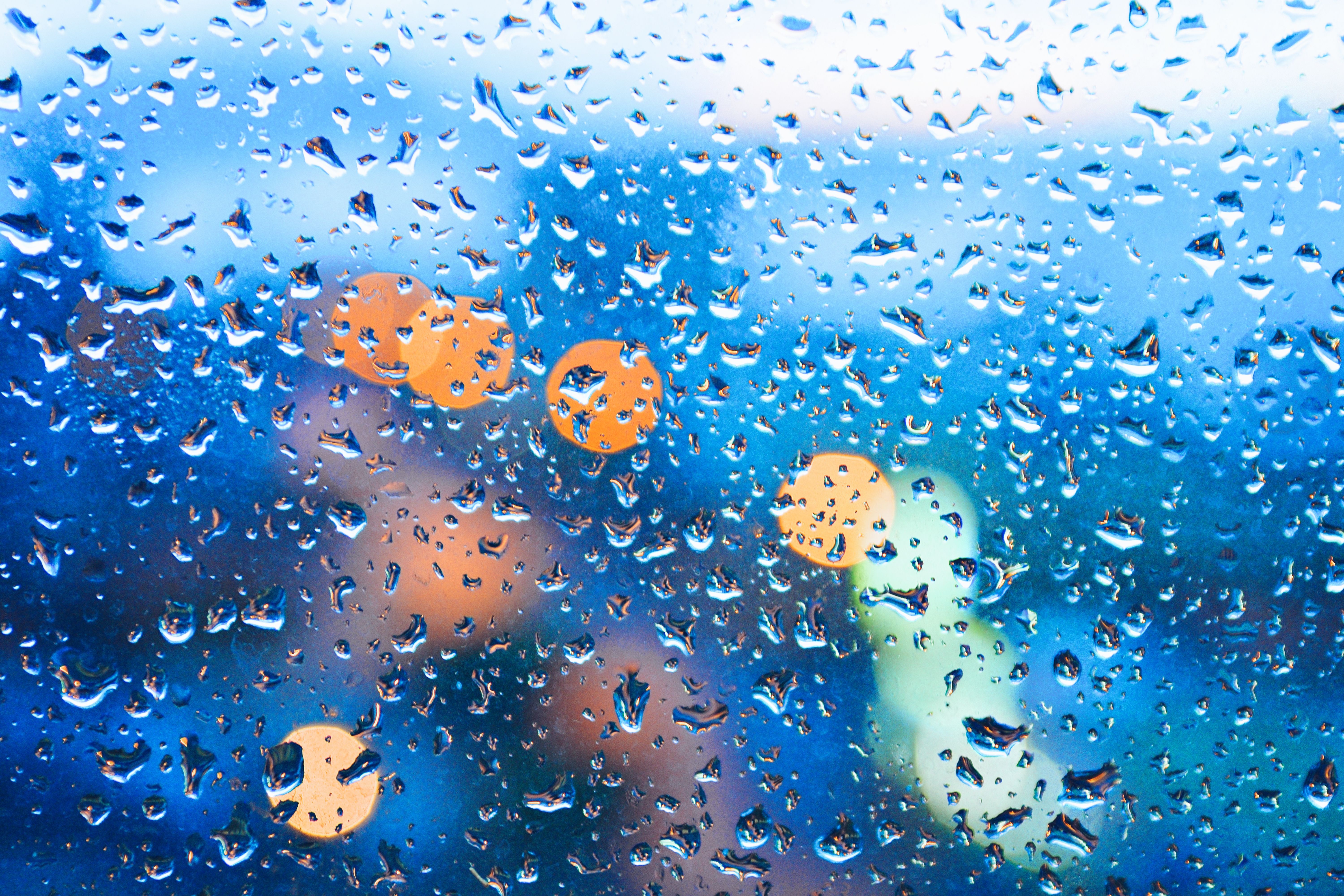 Raindrops on Window with City Lights Bokeh · Free Stock Photo