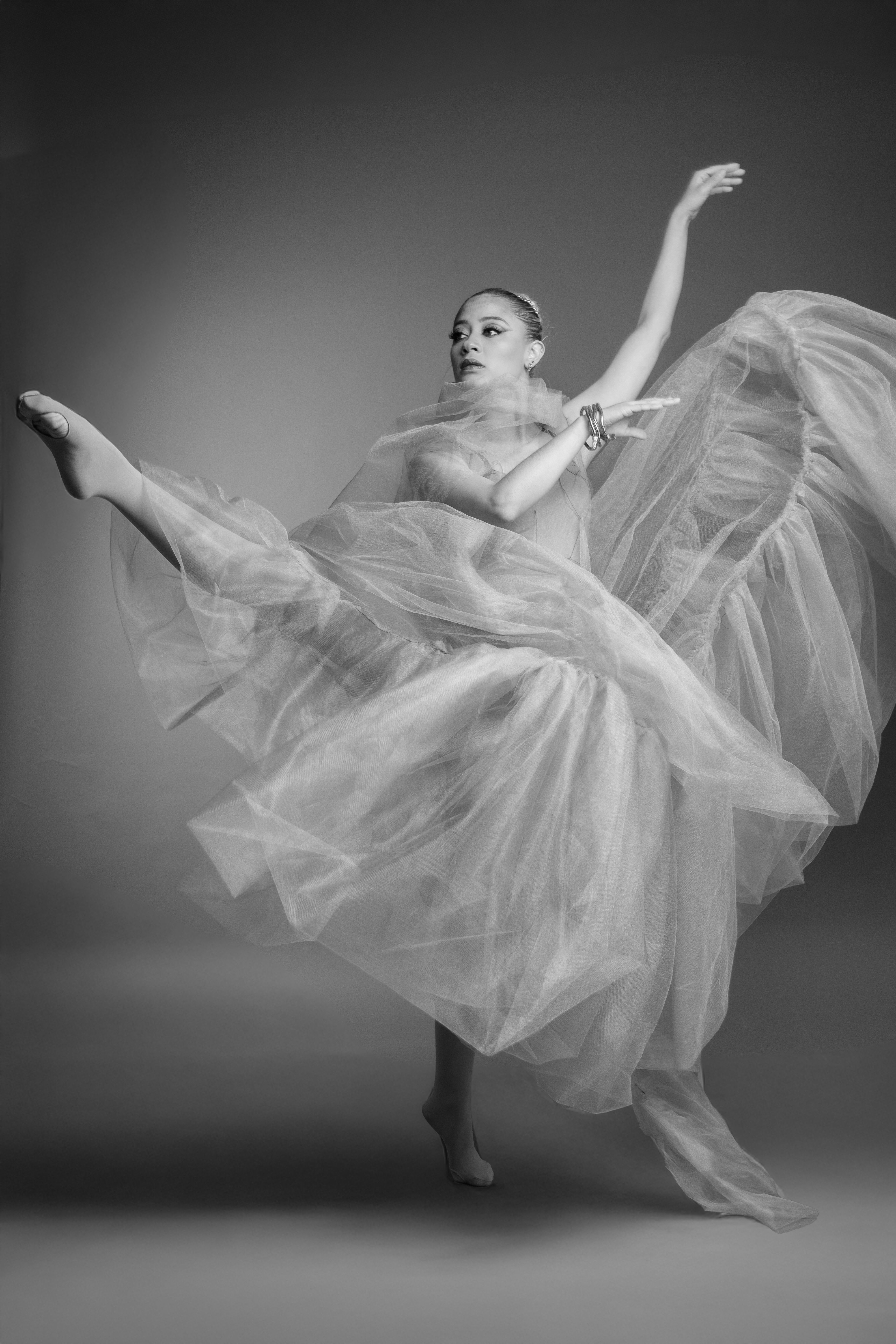 Graceful Ballet Pose in Flowing Dress · Free Stock Photo