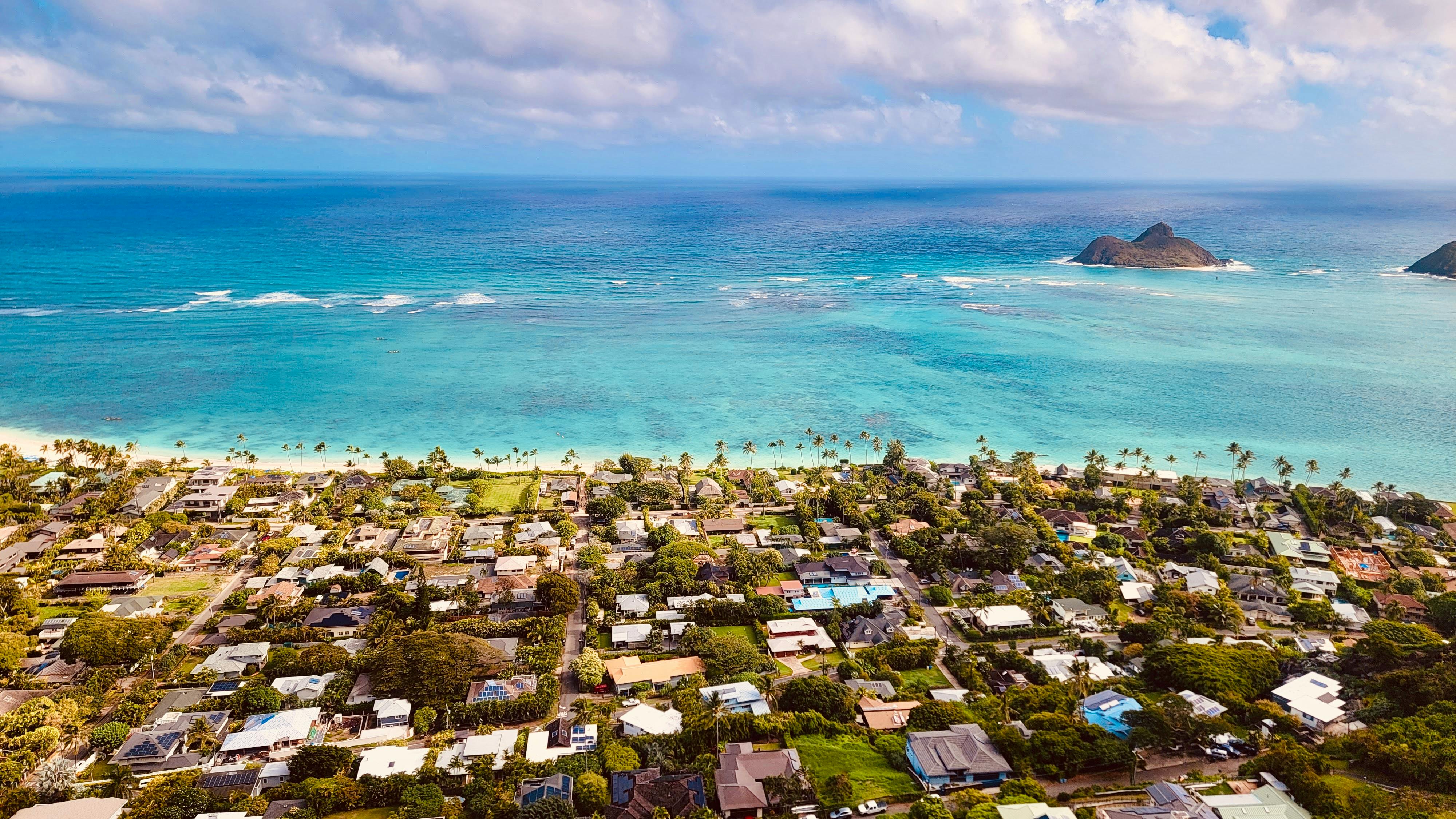 Aerial View of Coastal Town and Blue Ocean · Free Stock Photo